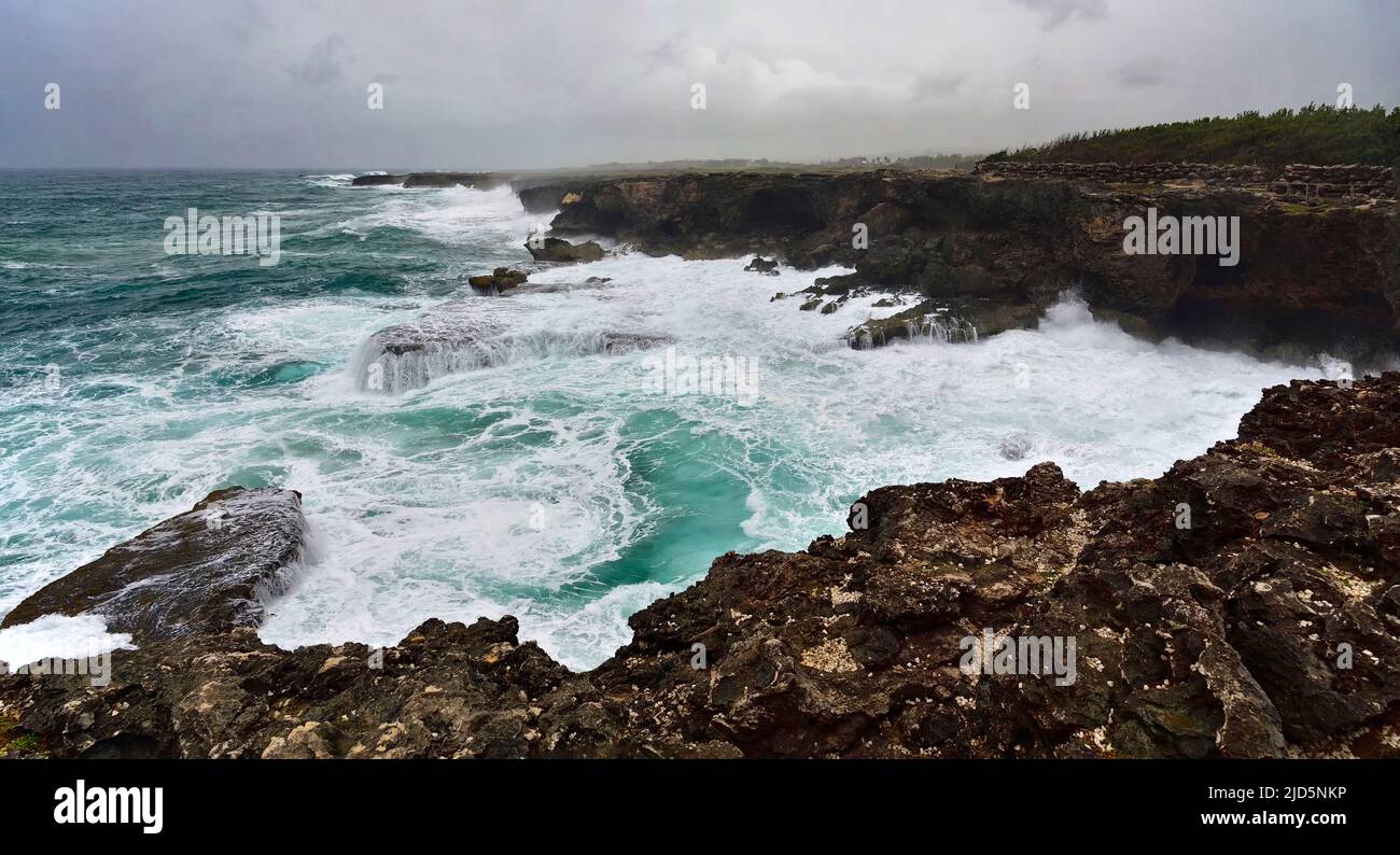 Rough ocean waves crashing against the rocky cliffs of North Point ...