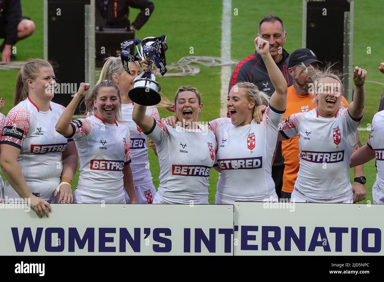 The England women national rugby league team lift the trophy after ...