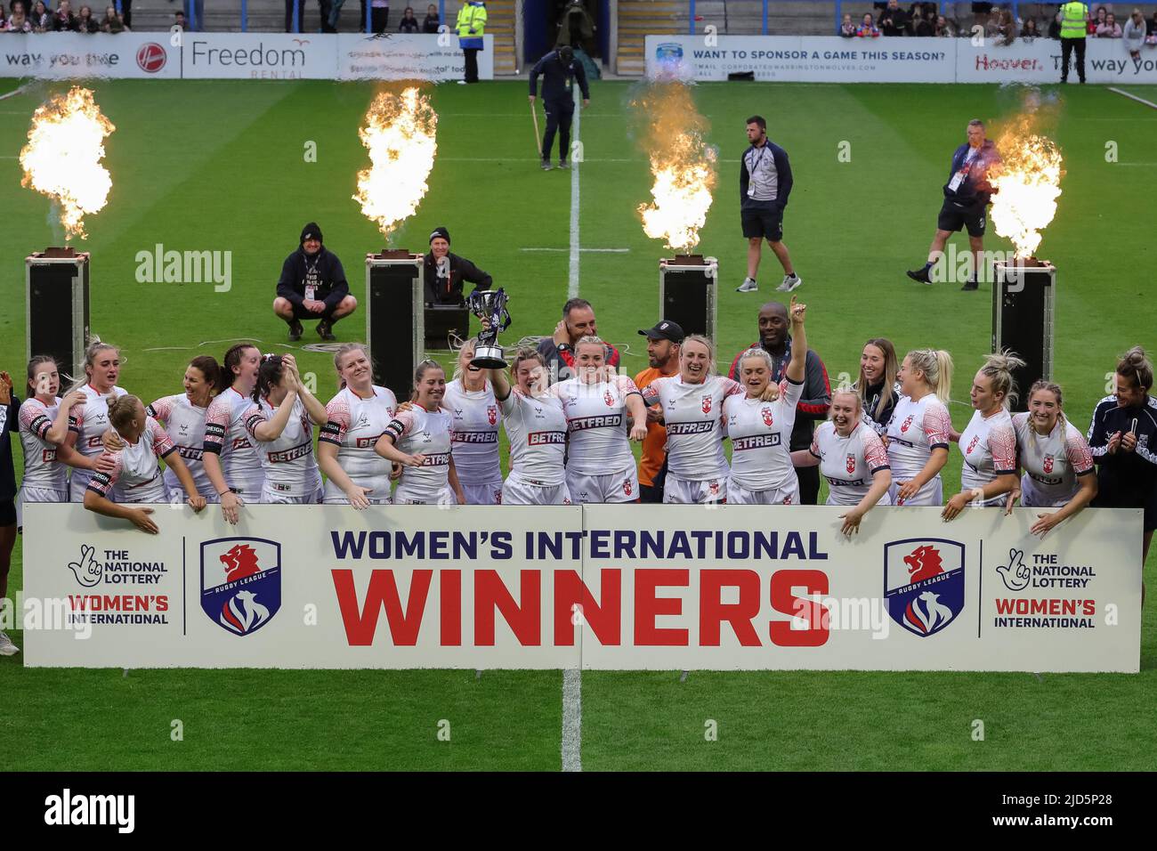 The England women national rugby league team lift the trophy after ...