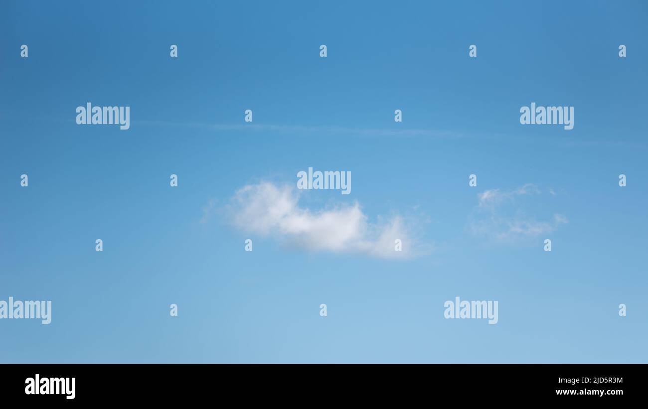 Beautiful Spring landscape white single cloud in clear blue sky ...