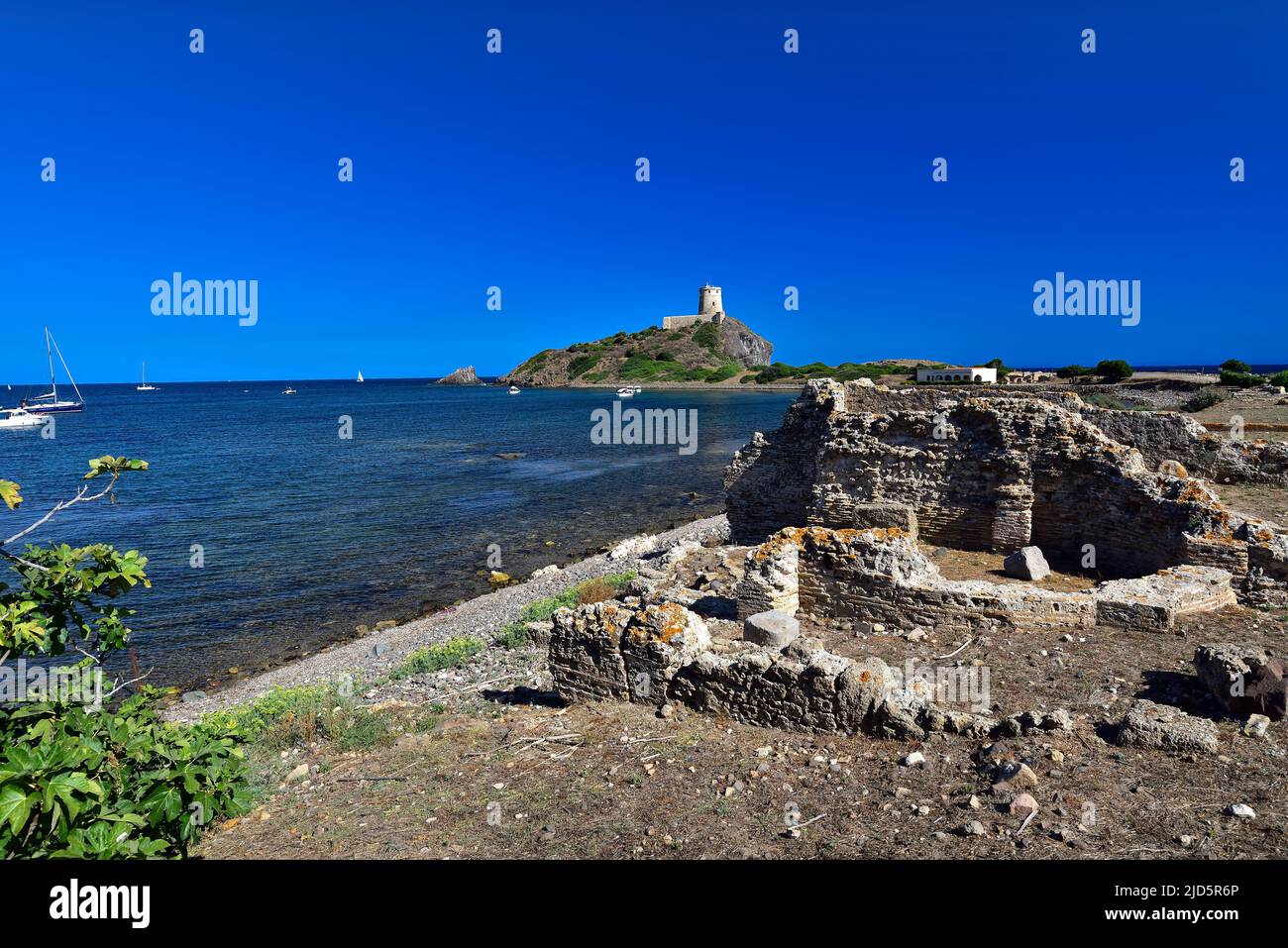 Uncovered excavations with an old tower in the background near the town ...