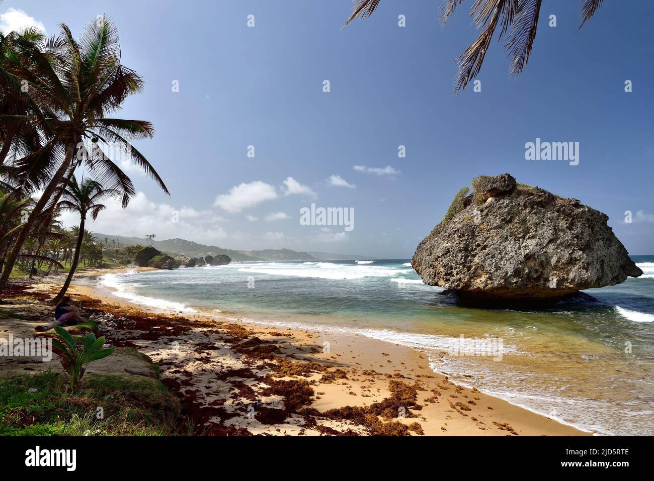 BATHSHEBA ,BARBADOS; February 23, 2020: Women sitting in the front of ...