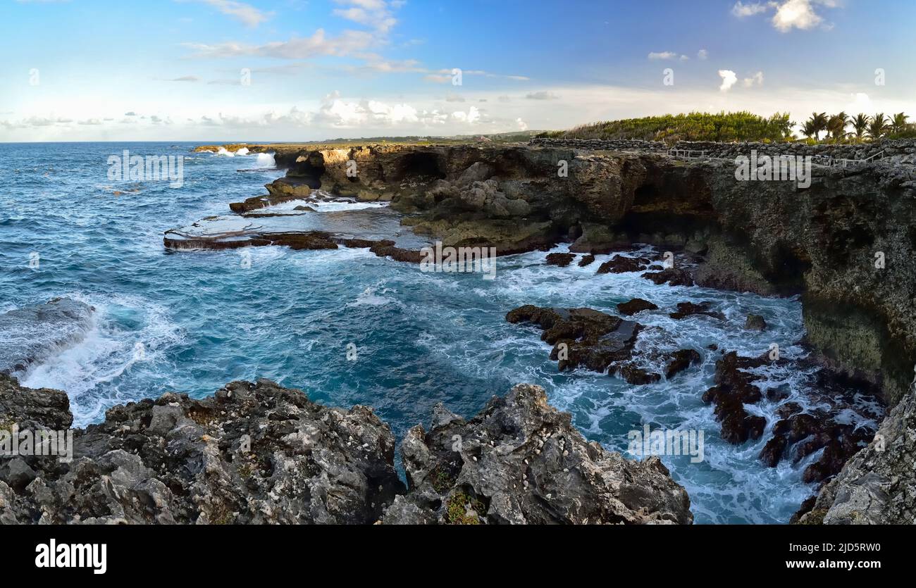 Rough ocean waves crashing against the rocky cliffs of North Point ...