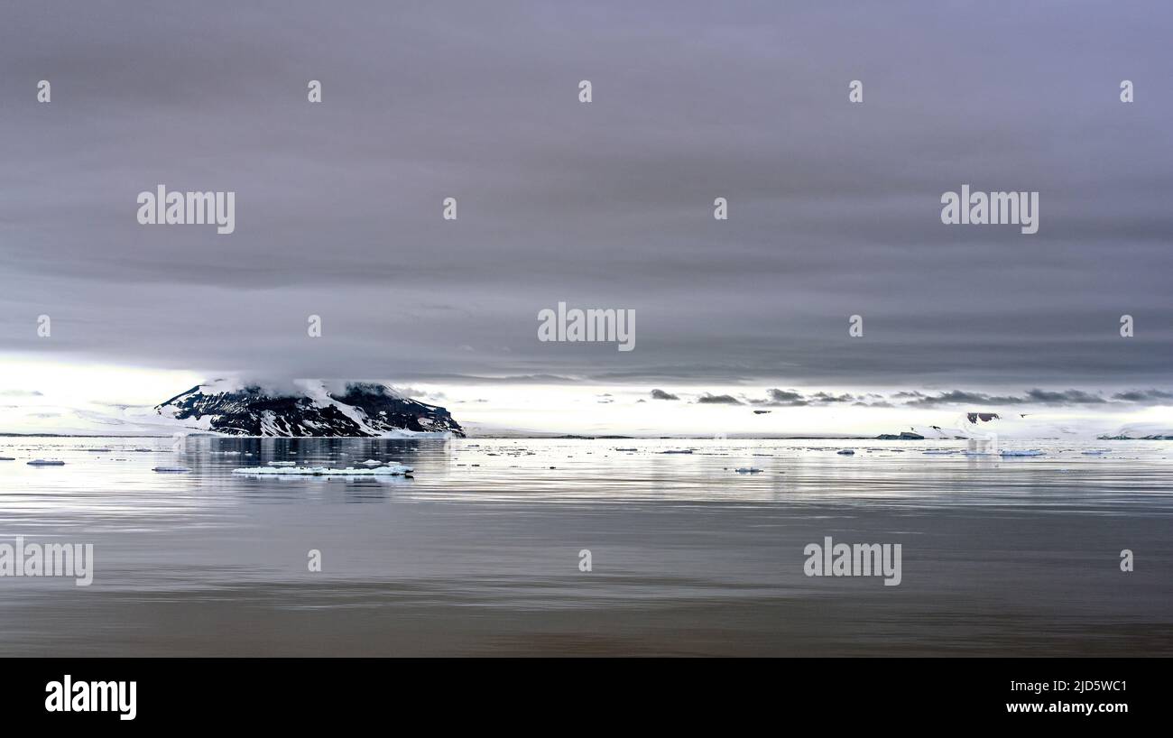 Island, drift ice and calm sea in the Antarctic Sound on the northern ...