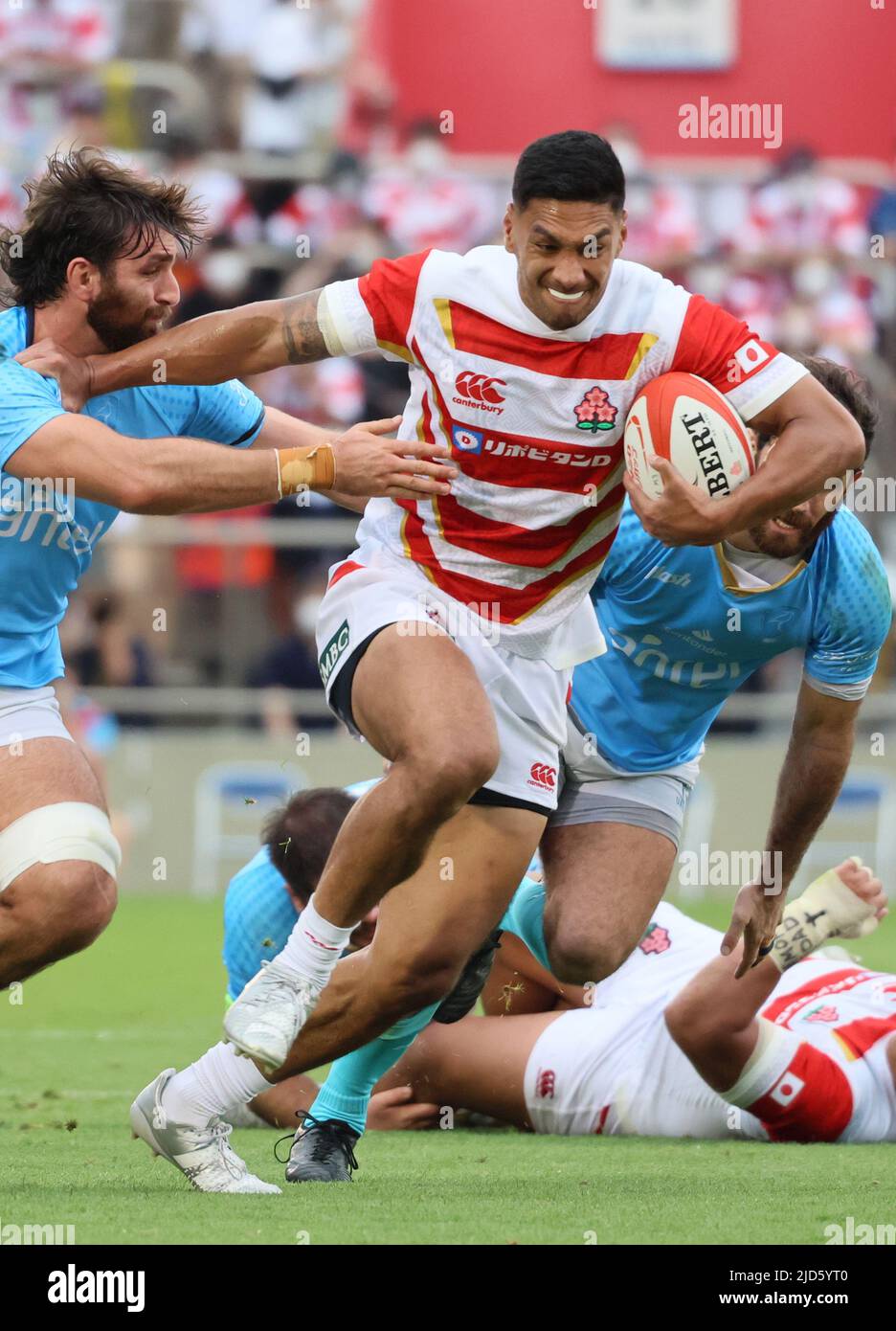 Tokyo, Japan. 18th June, 2022. Japan's center Timothy Lafaele carries ...