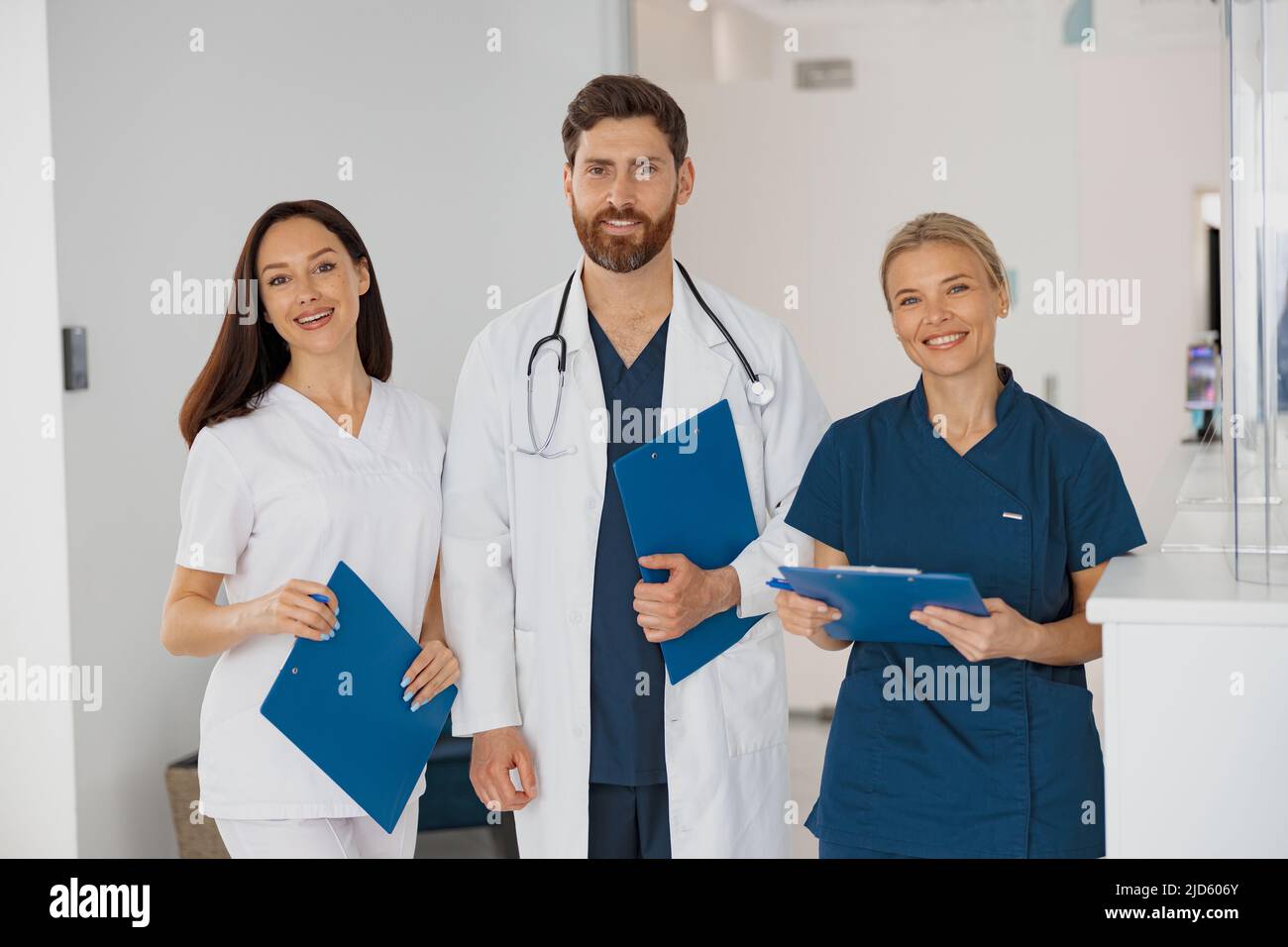 Portrait of a group of happy and successful doctors and nurses standing ...