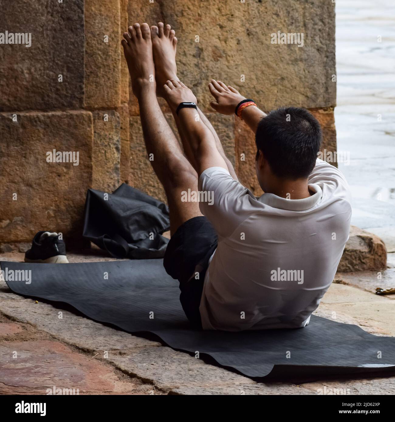 Inspired Indian young man doing yoga asanas in Lodhi Garden Park, New ...