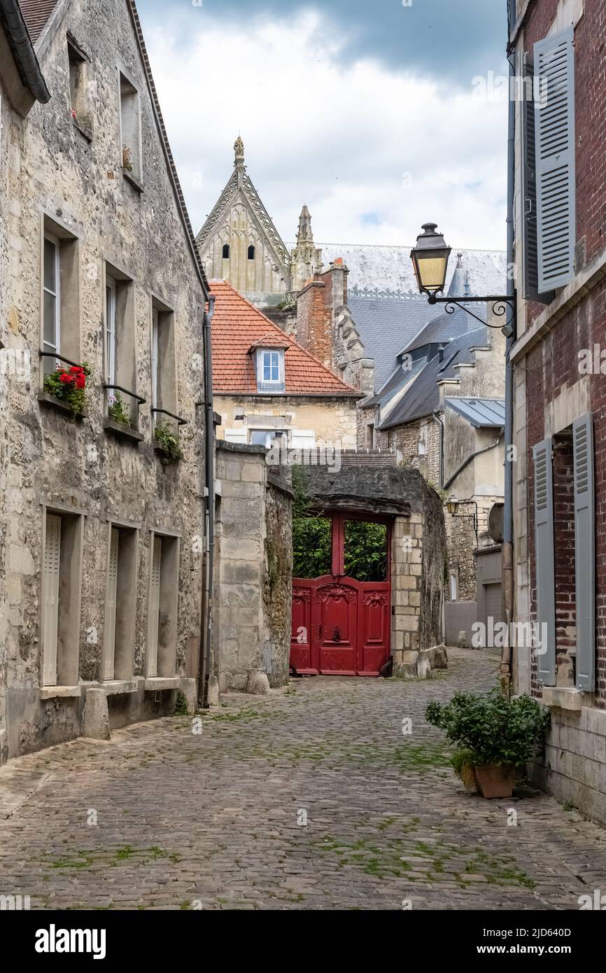 Senlis, medieval city in France, typical street with ancient houses ...