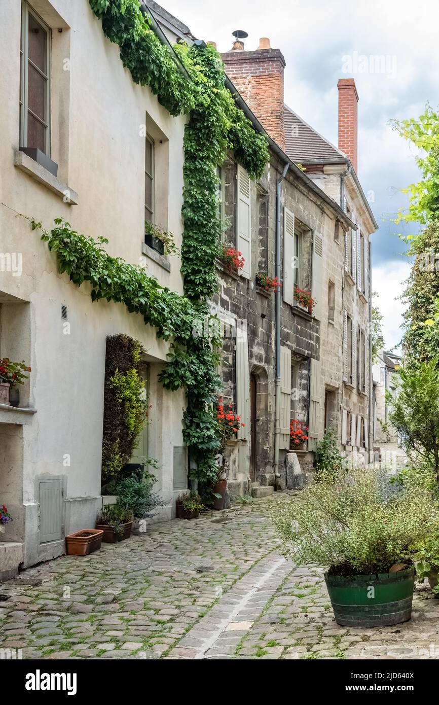 Senlis, medieval city in France, typical street with ancient houses ...