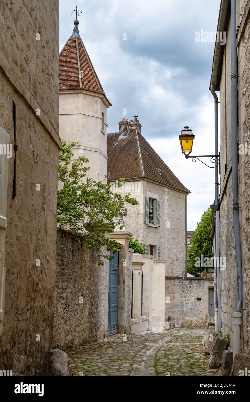 Senlis, medieval city in France, typical street with ancient houses ...