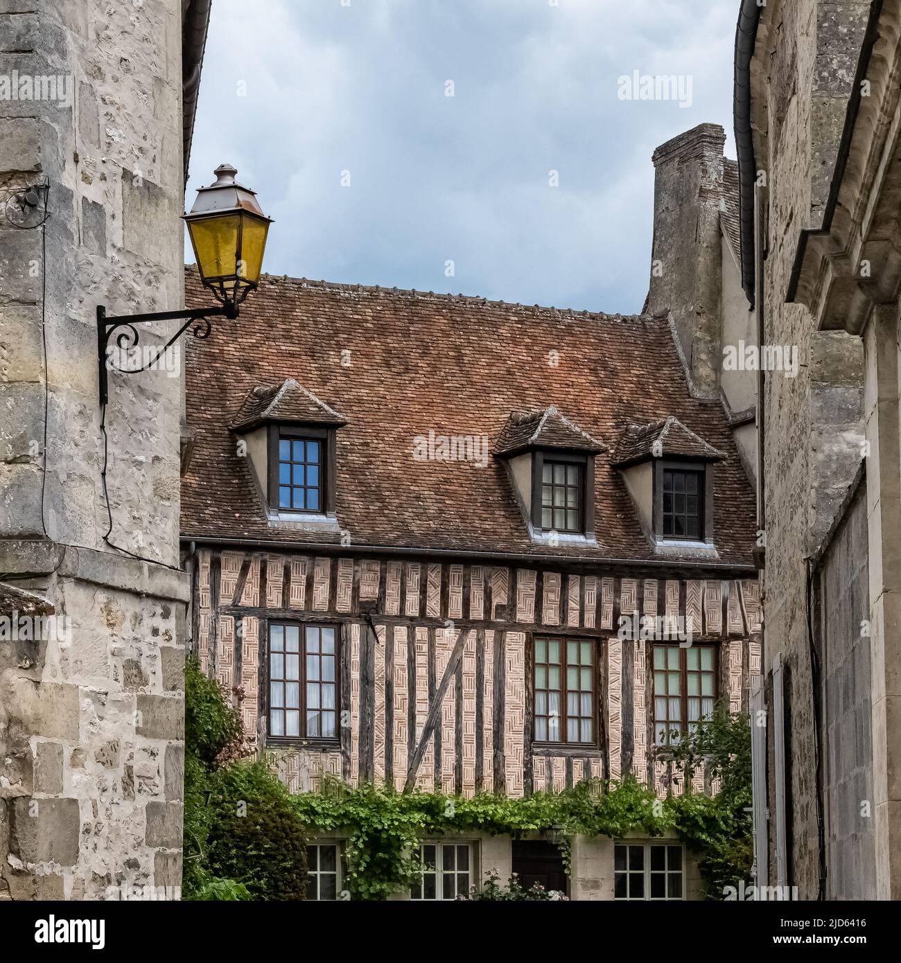 Senlis, medieval city in France, typical street with ancient houses ...