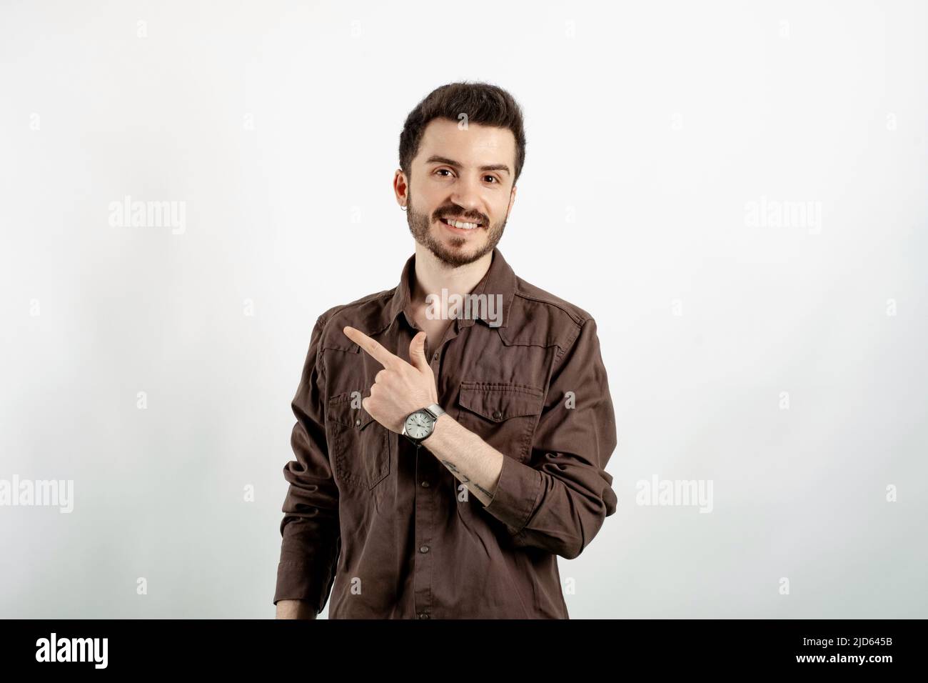 Happy young man wearing shirt posing isolated over white background ...