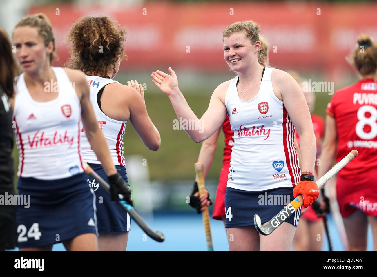 England's Tessa Howard (right) smiles after the Women's FIH Hockey Pro ...