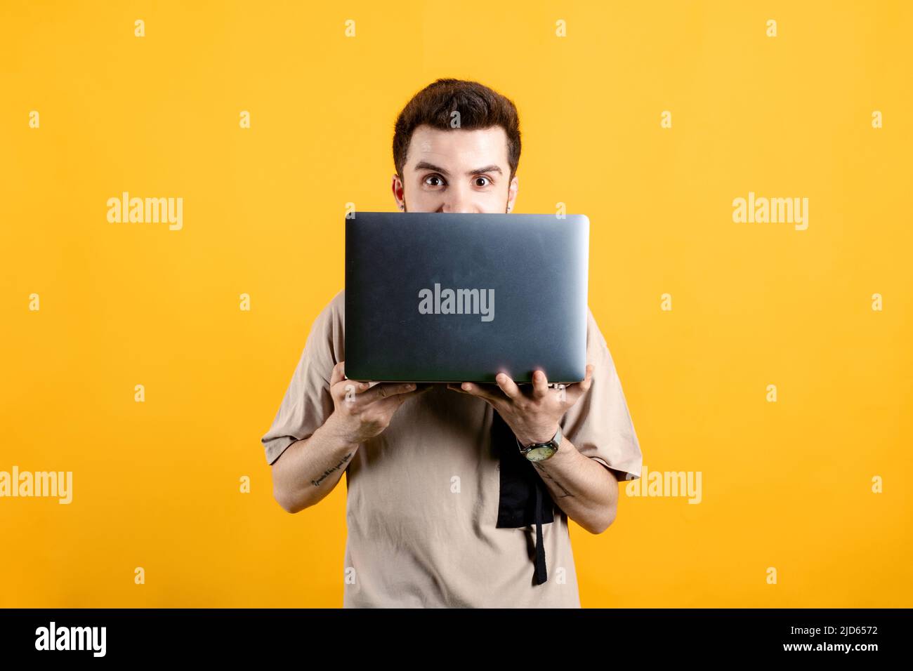 Handsome young man wearing casual clothes posing isolated over yellow ...
