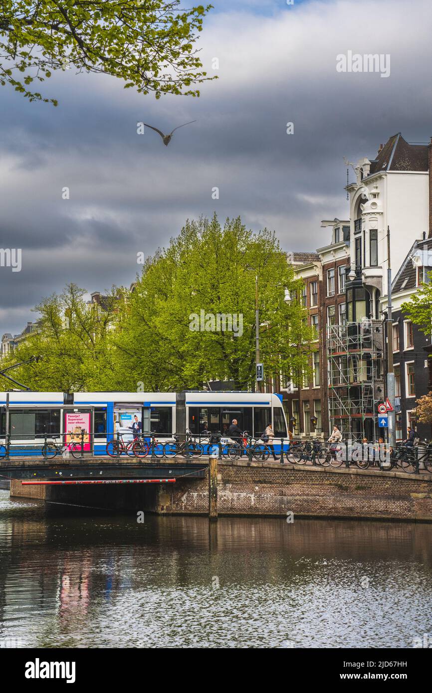 Tram driving over a bridge Stock Photo - Alamy