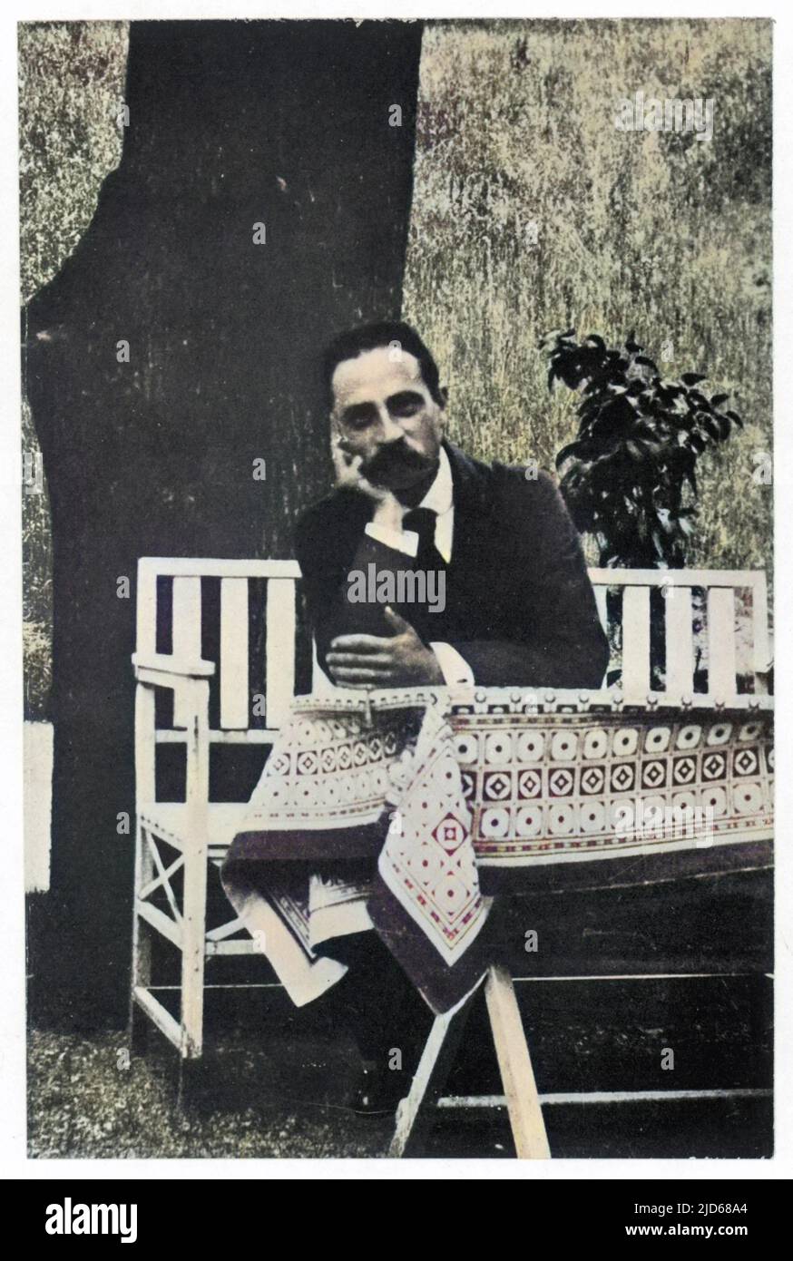 RAINER MARIA RILKE German poet sitting at a table in a garden ...