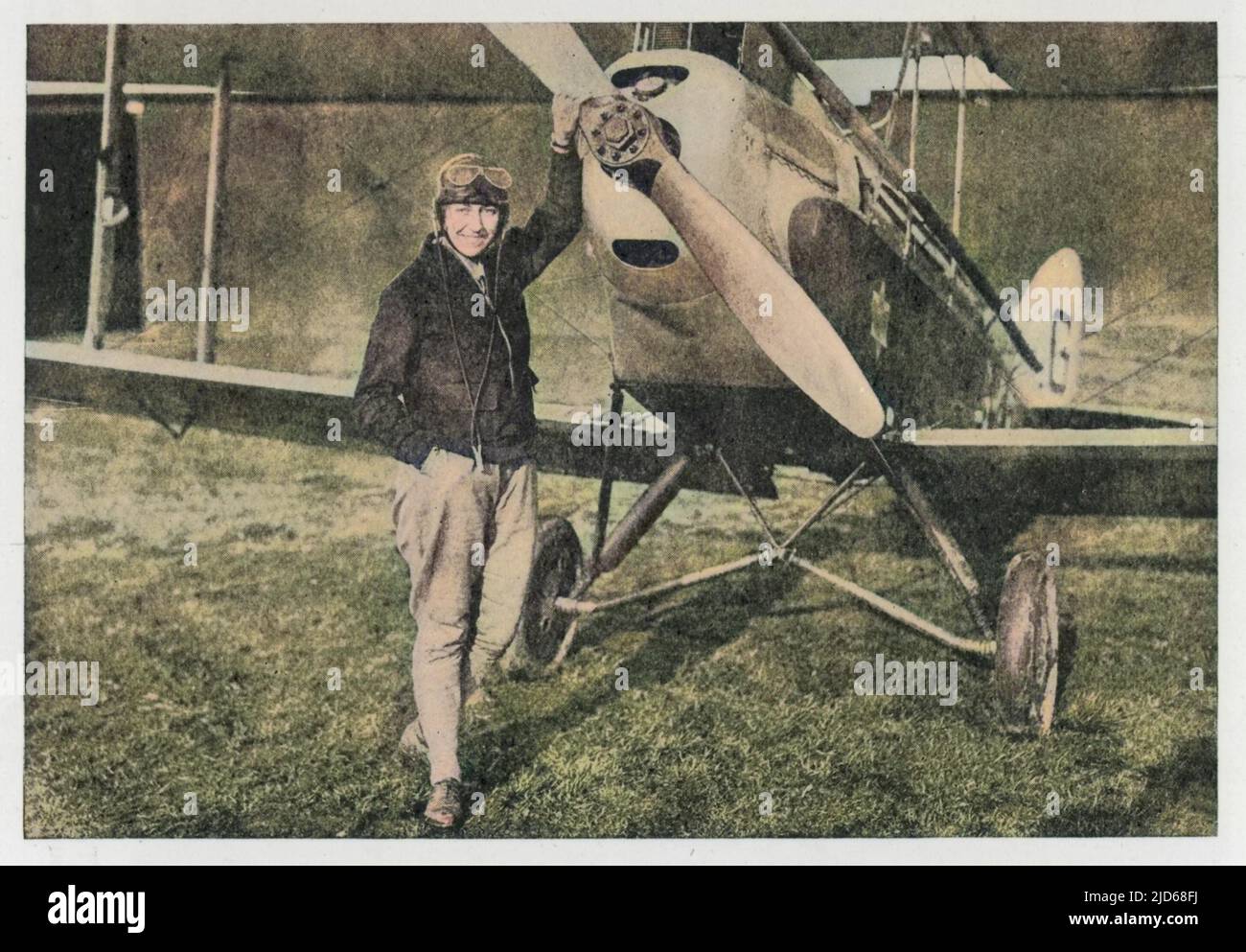 Standing next to the Gypsy Moth in which she made the first solo flight ...