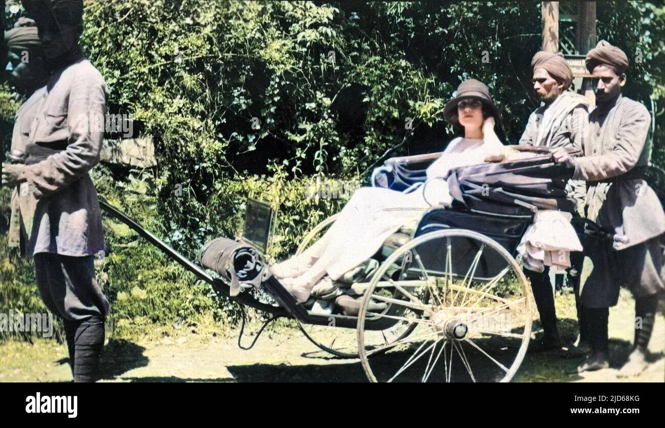 Four men are required to propel this European lady in her rickshaw ...