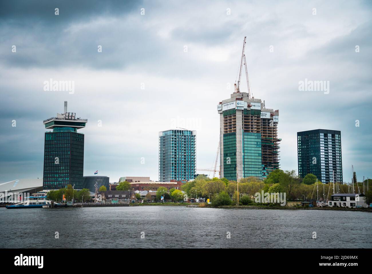 Skyscrapers next to a river Stock Photo - Alamy