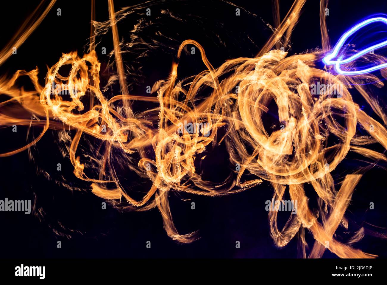 Fire in dark. Fire show at night. Chaotic flames. Lines of fire ...