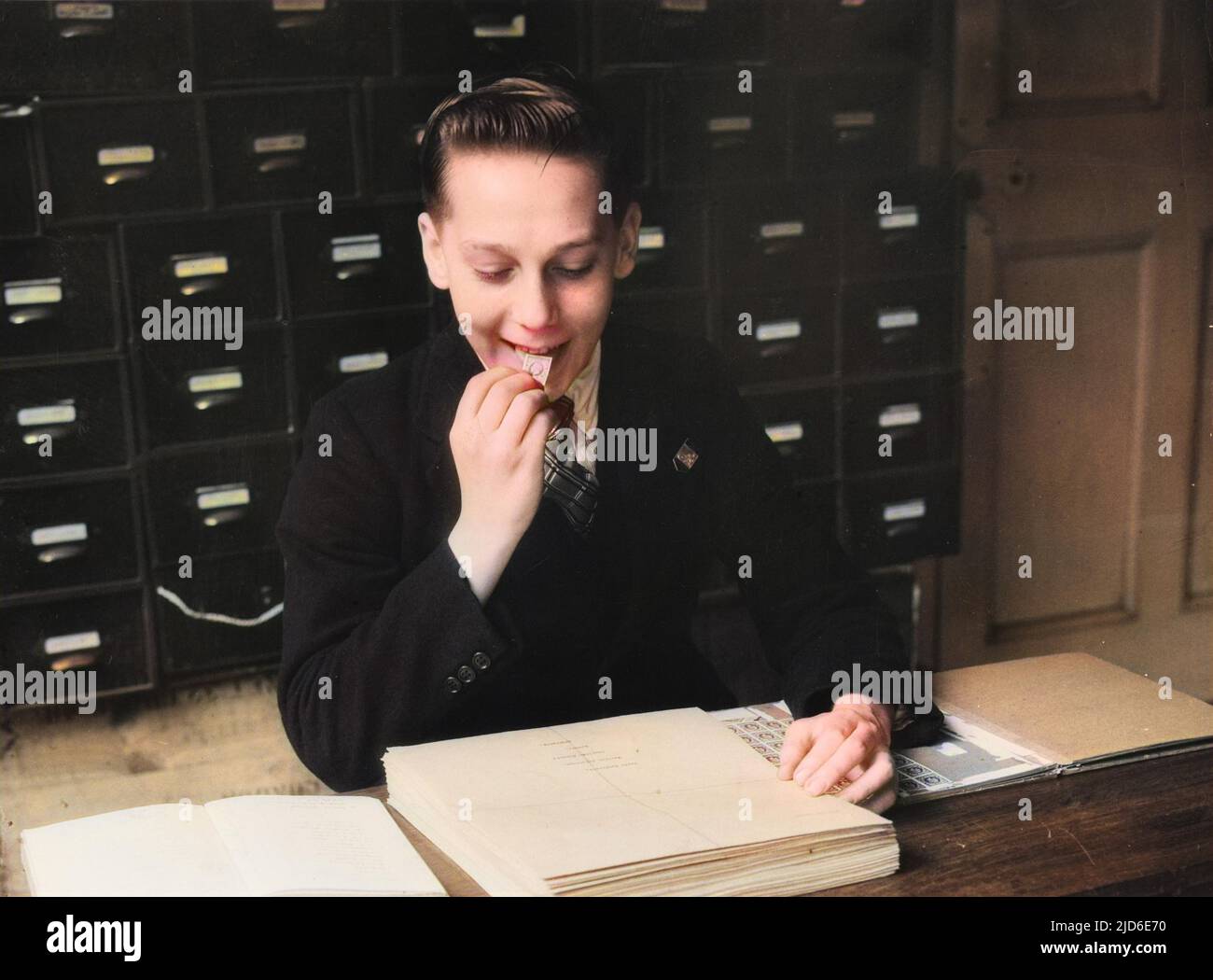 Licking envelope stamp hi-res stock photography and images - Alamy