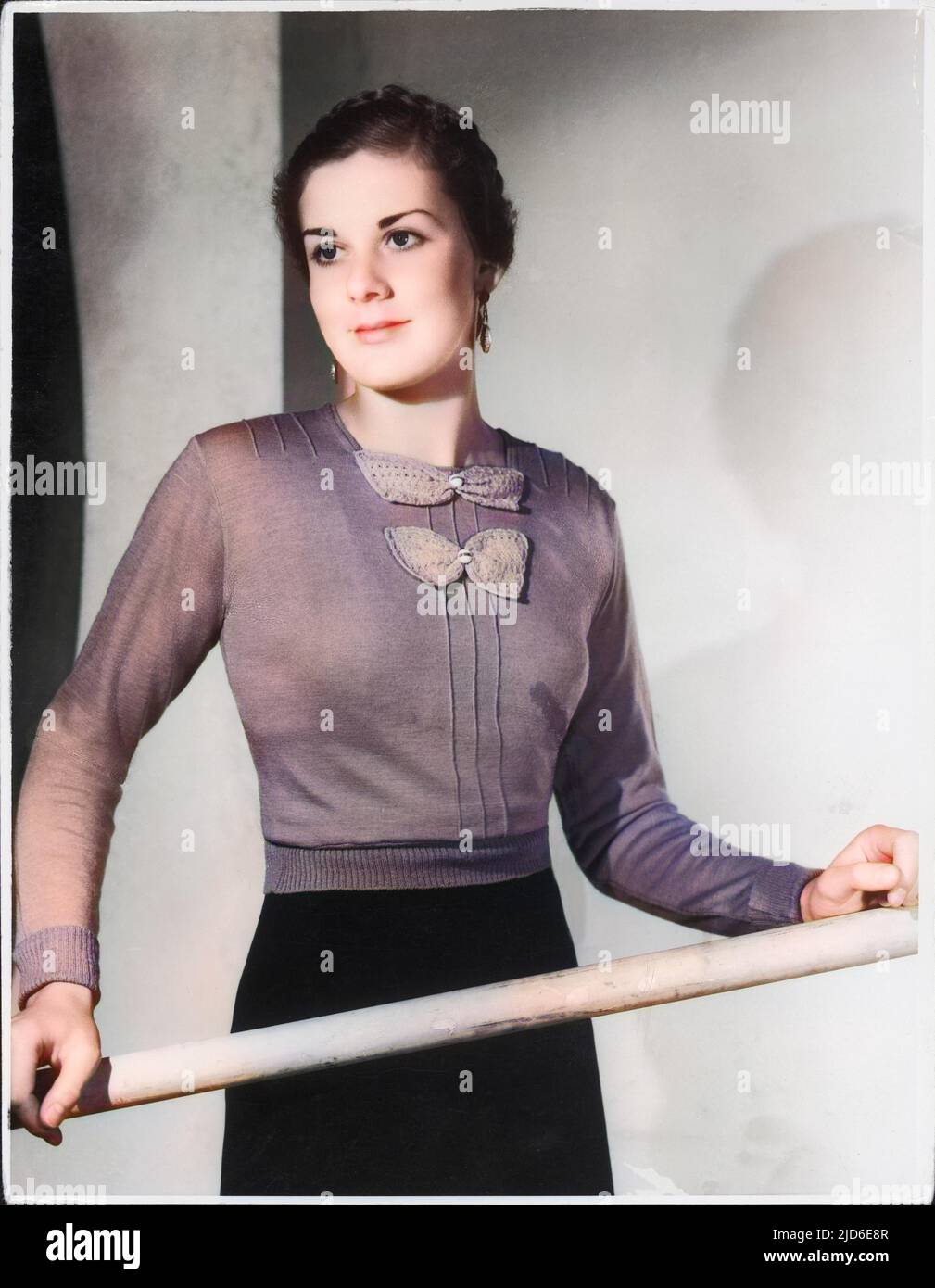 A machine-knitted jumper with narrow pleat detail on the shoulders ...