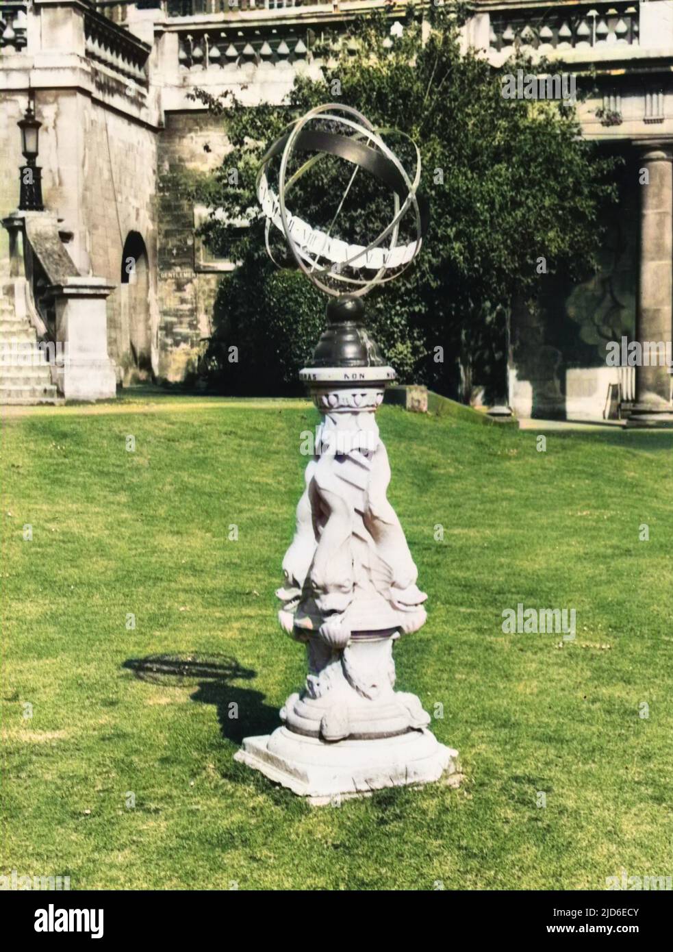 An unusual armillary sphere sundial with a base with fish sculpted into ...