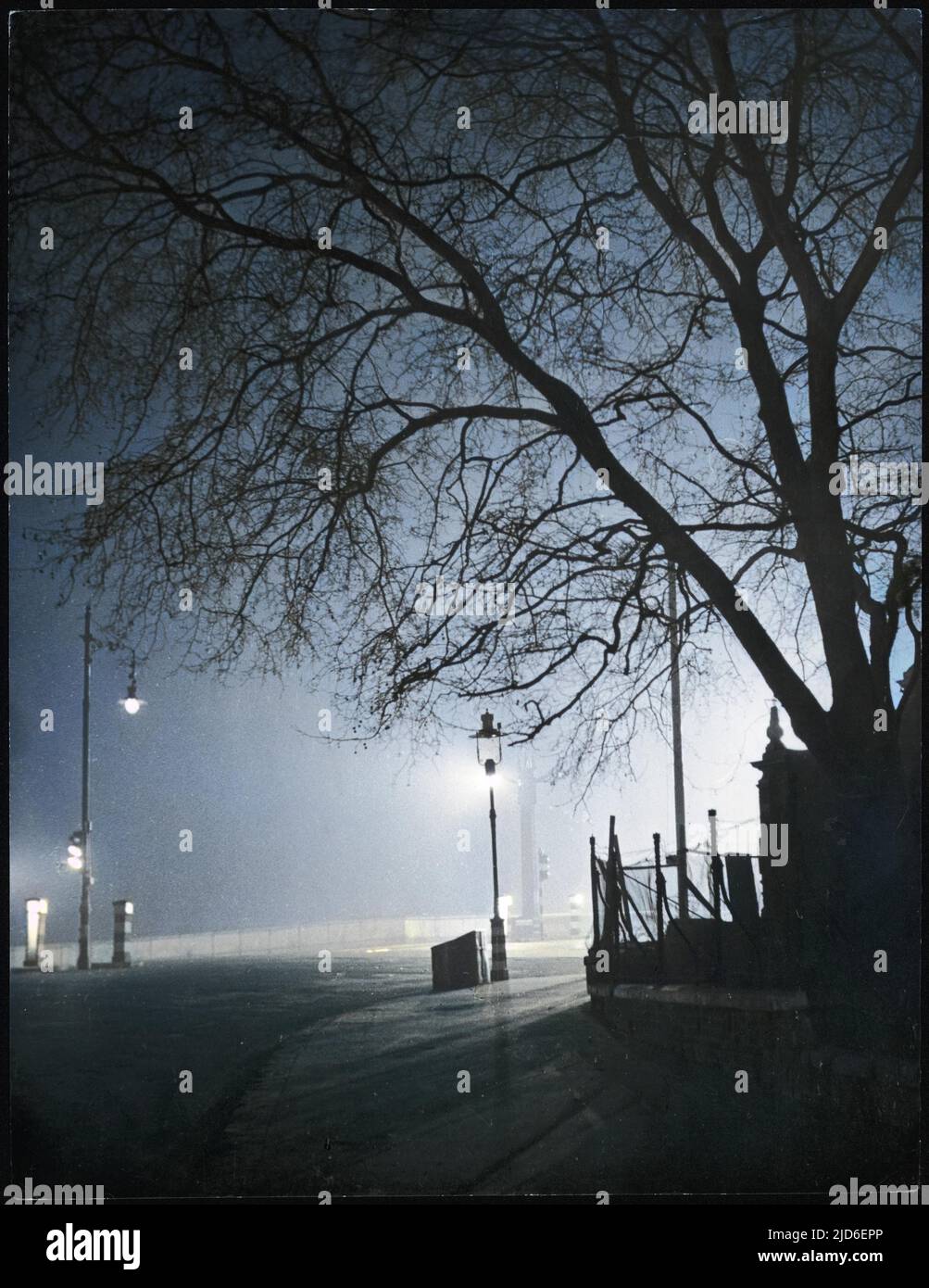 A rather eerie night scene, showing a deserted, foggy street by ...