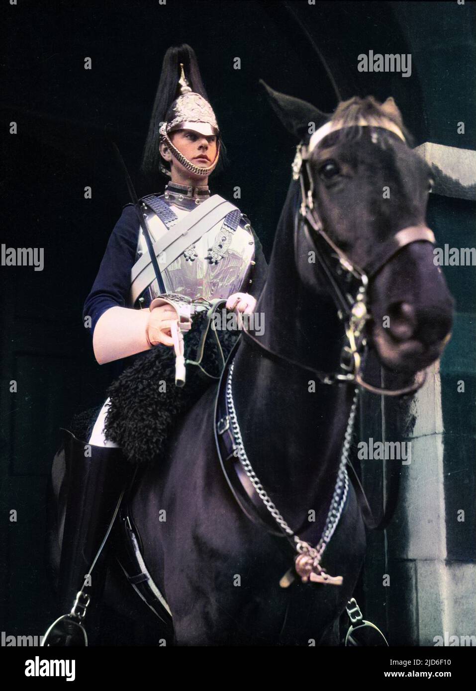 A horse guard at Whitehall, central London, England. Colourised version ...