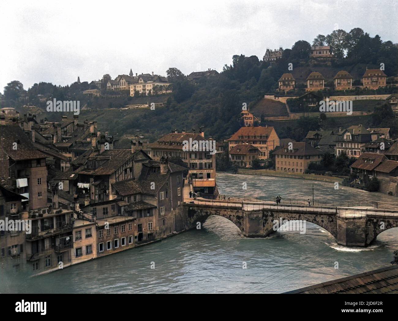 Riverside buildings and one of the bridges of Berne, Switzerland ...