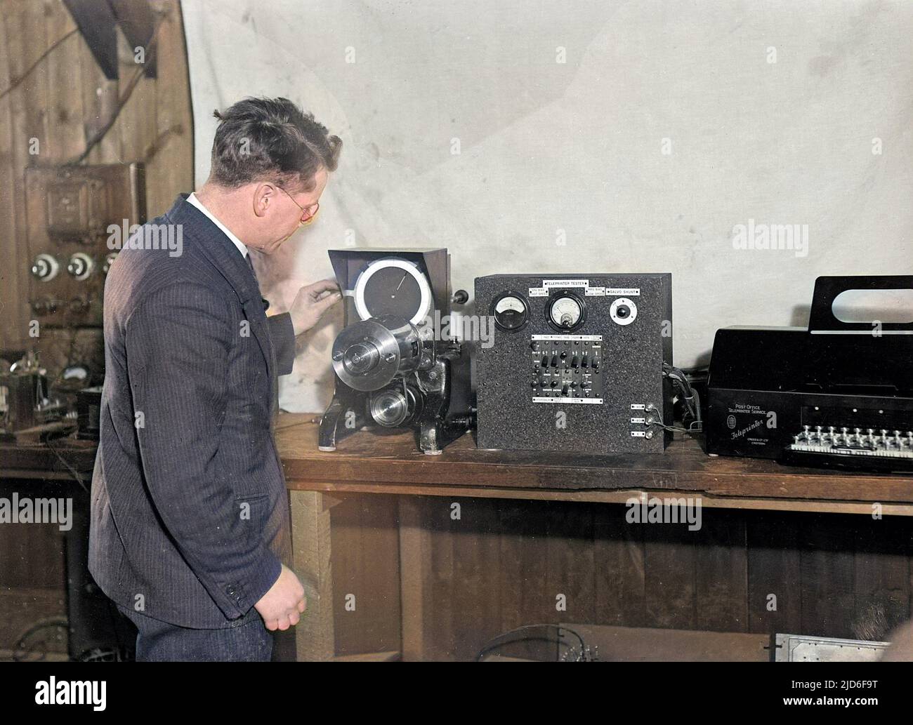 A telewriter at Dollis Hill telephone exchange, London. Colourised ...