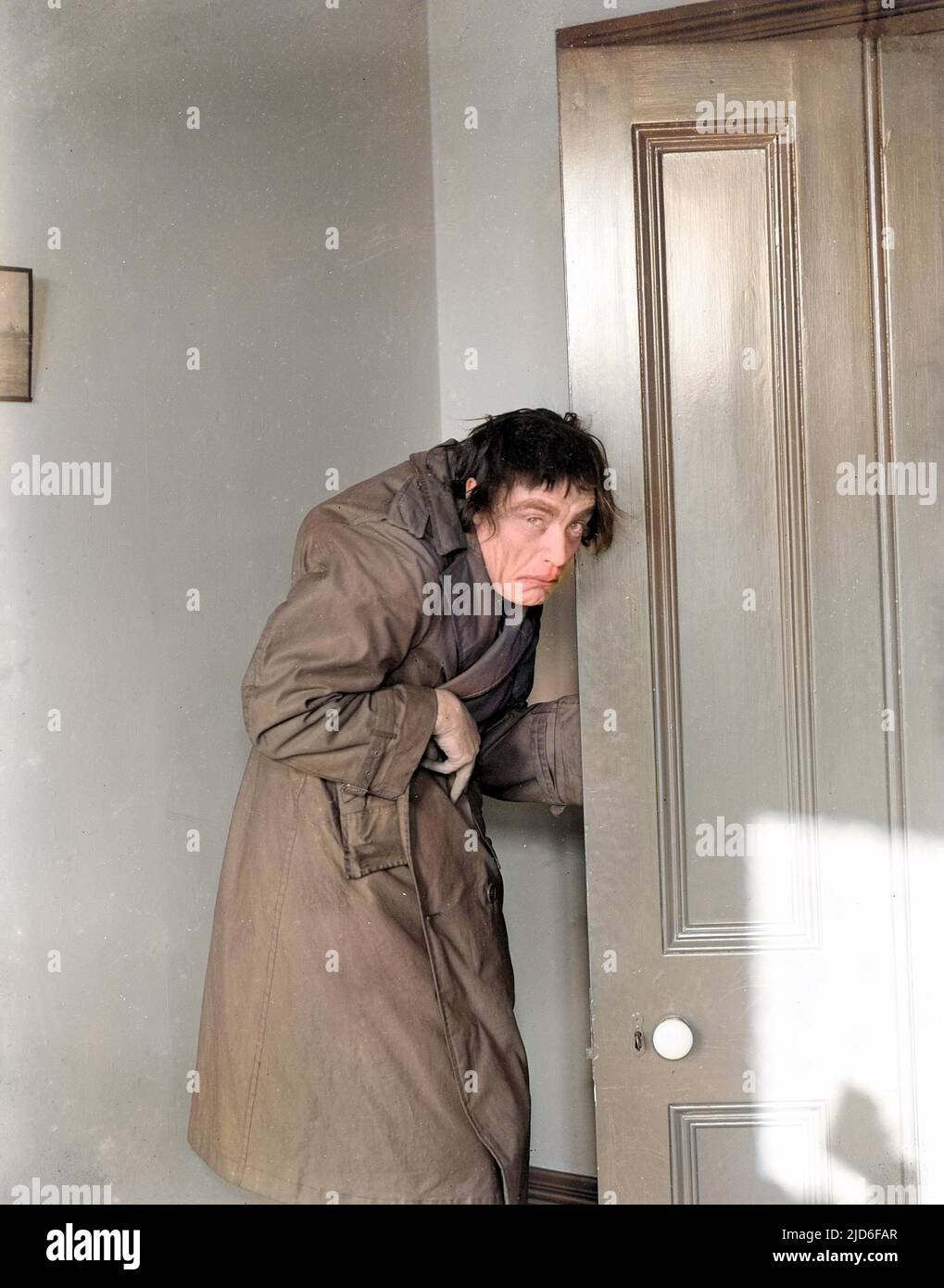 Actor George H. Mulcaster (1891 - 1964), creeps out of his dressing ...