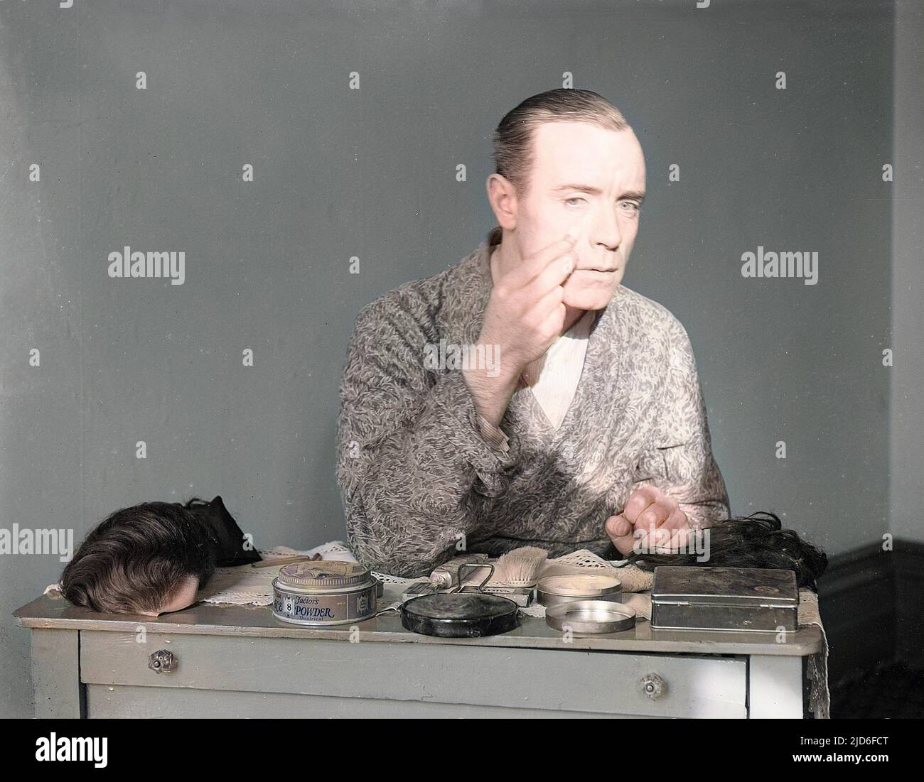 Actor George H. Mulcaster (1891 - 1964), in his dressing room, applying ...