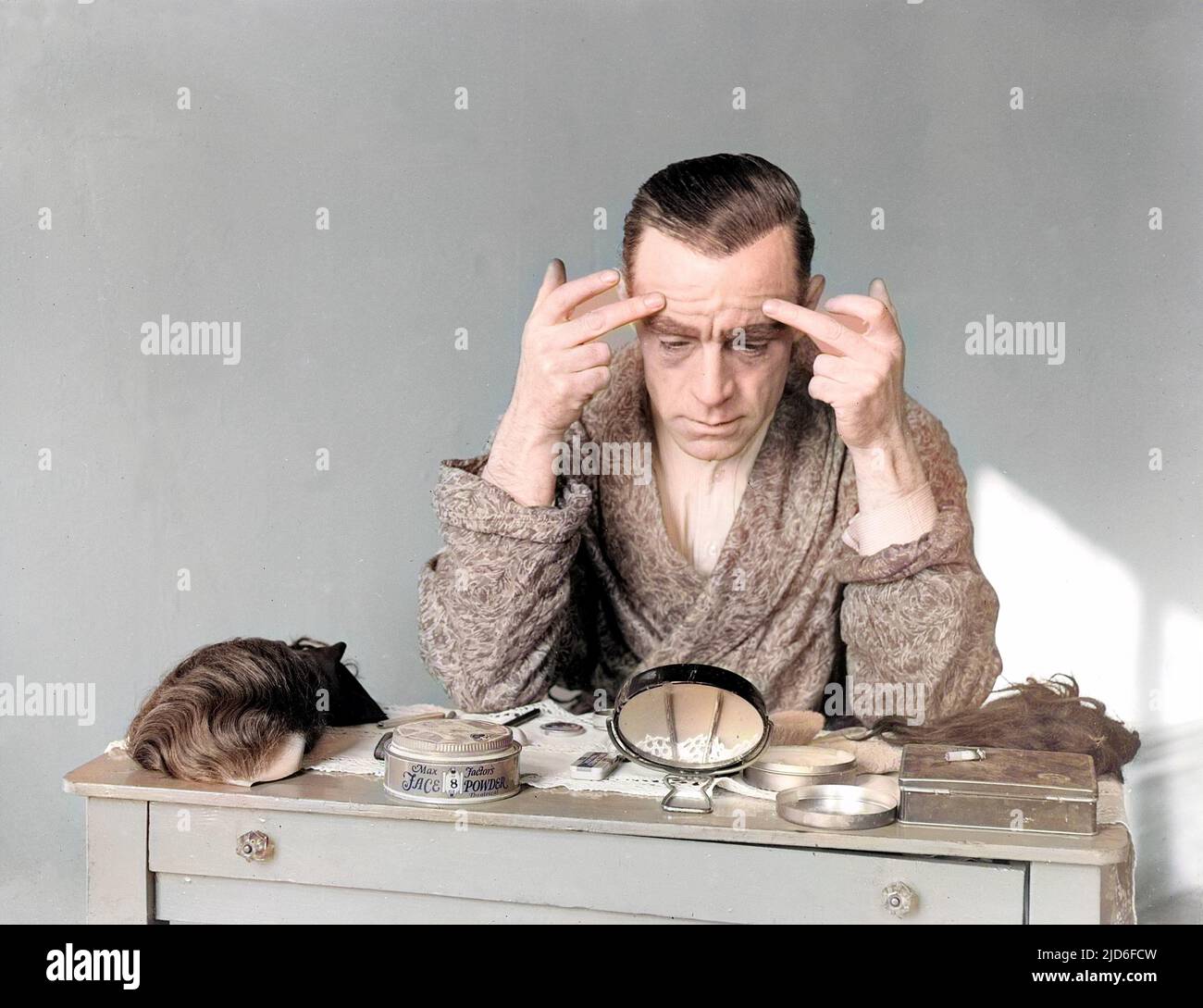 Actor George H. Mulcaster (1891 - 1964), in his dressing room, applying ...