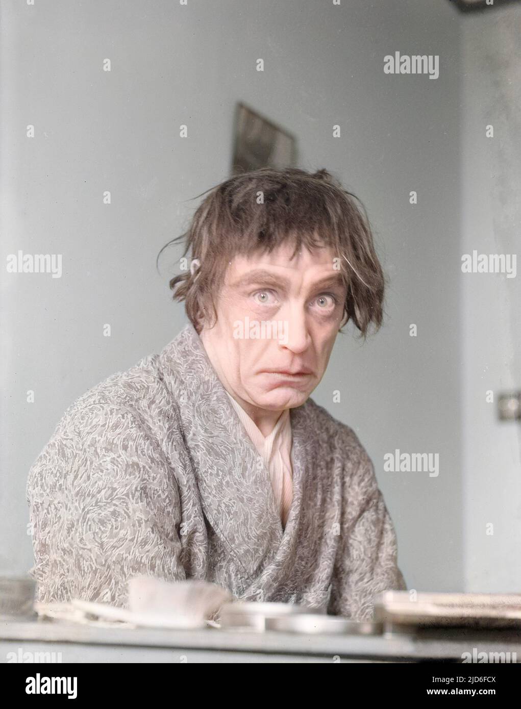 Actor George H. Mulcaster (1891 - 1964), in his dressing room wearing a ...