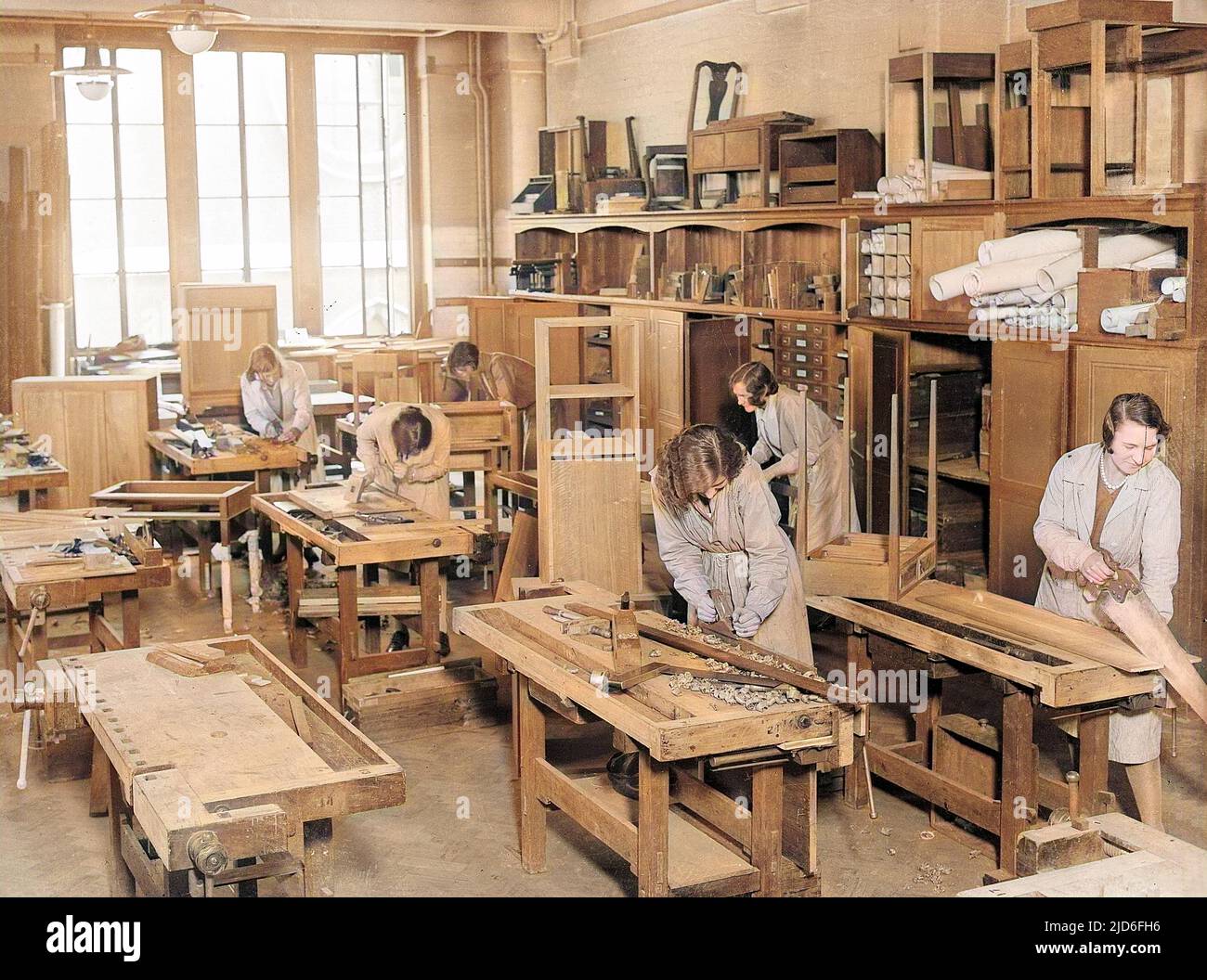 A class of German girls learning carpentry. Colourised version of ...