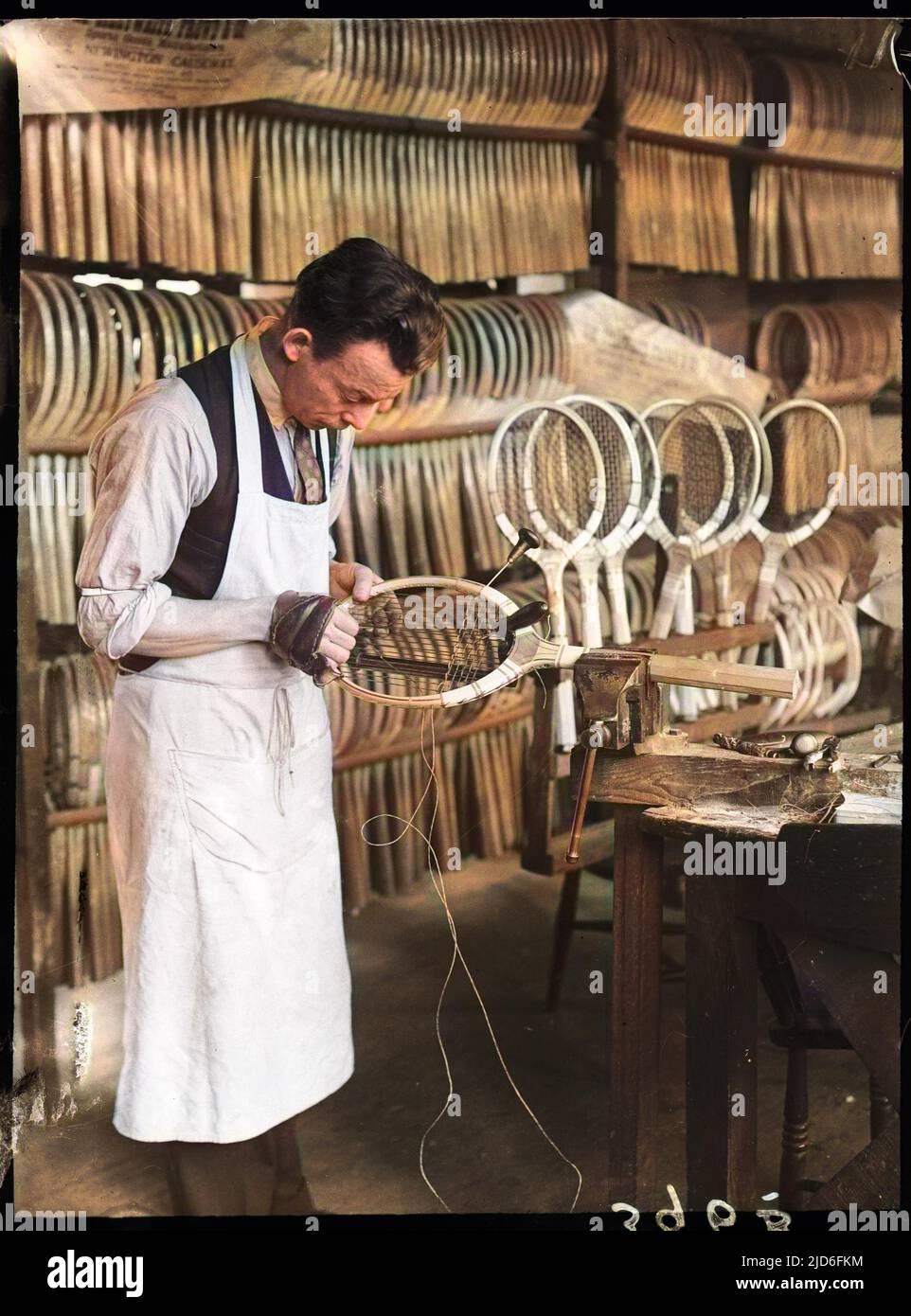 Stringing new tennis racquets at a workshop in Wimbledon, London ...