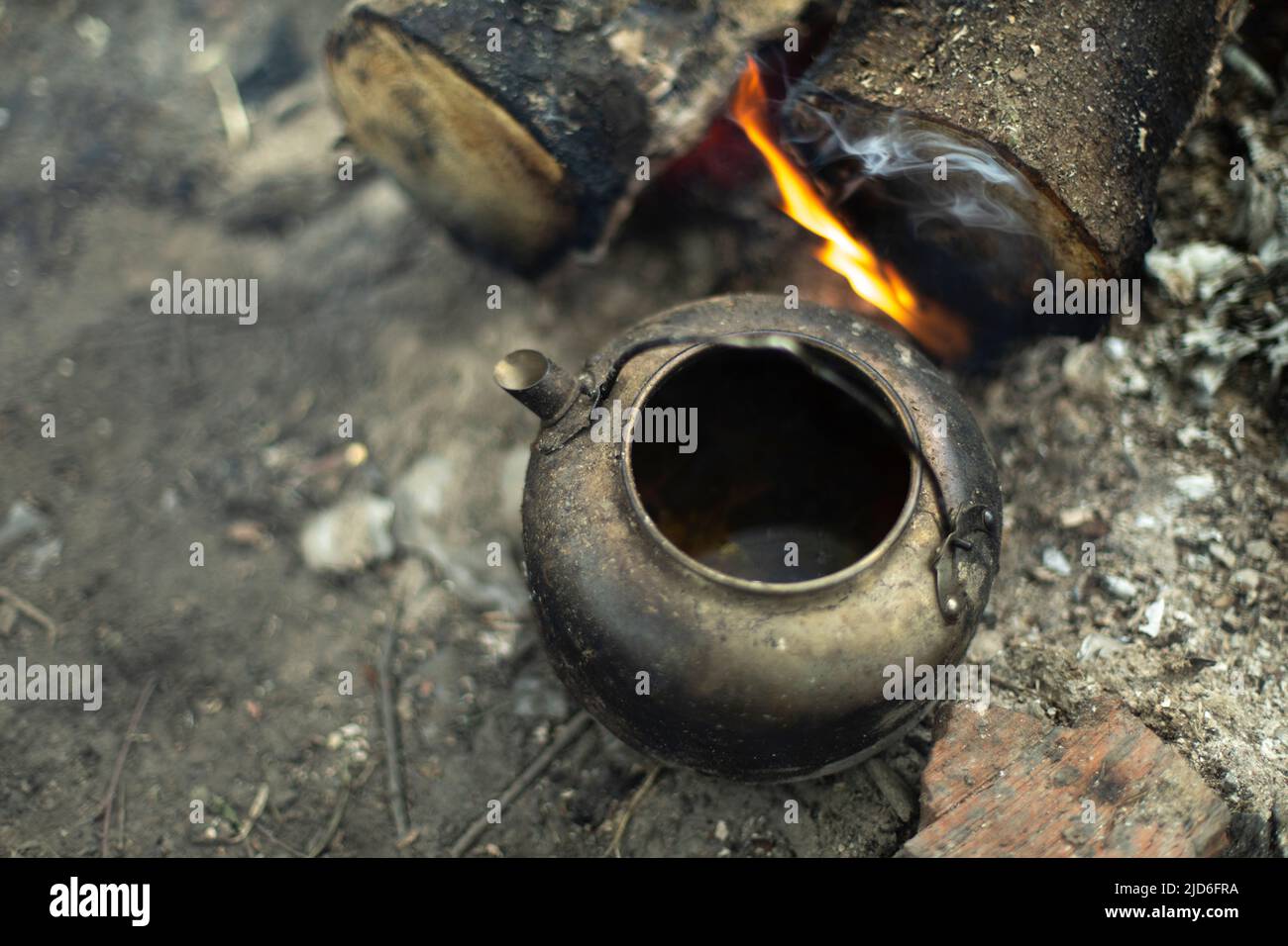 Kettle for tea on fire. Tea in nature. Heating water in fire Stock ...