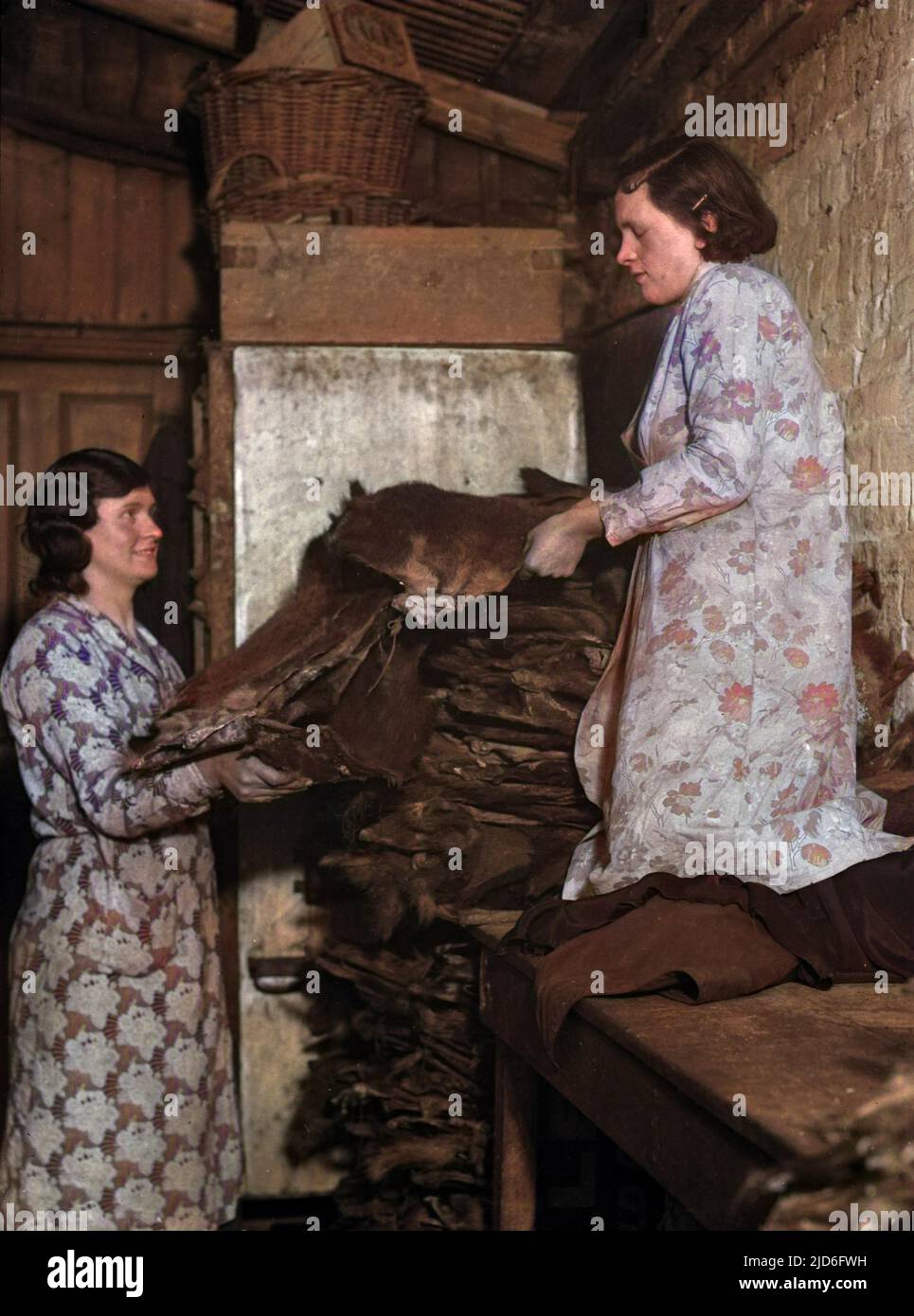 Two Factory Girls Making A Huge Pile Of Christmas Stockings Colourised