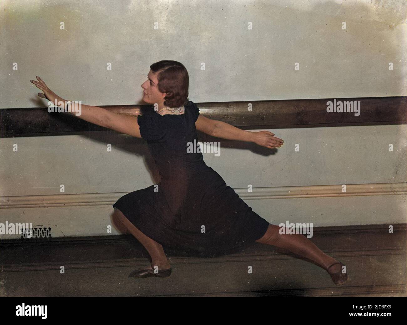 A young woman demonstrates how to perform 'physical jerks' as part of ...