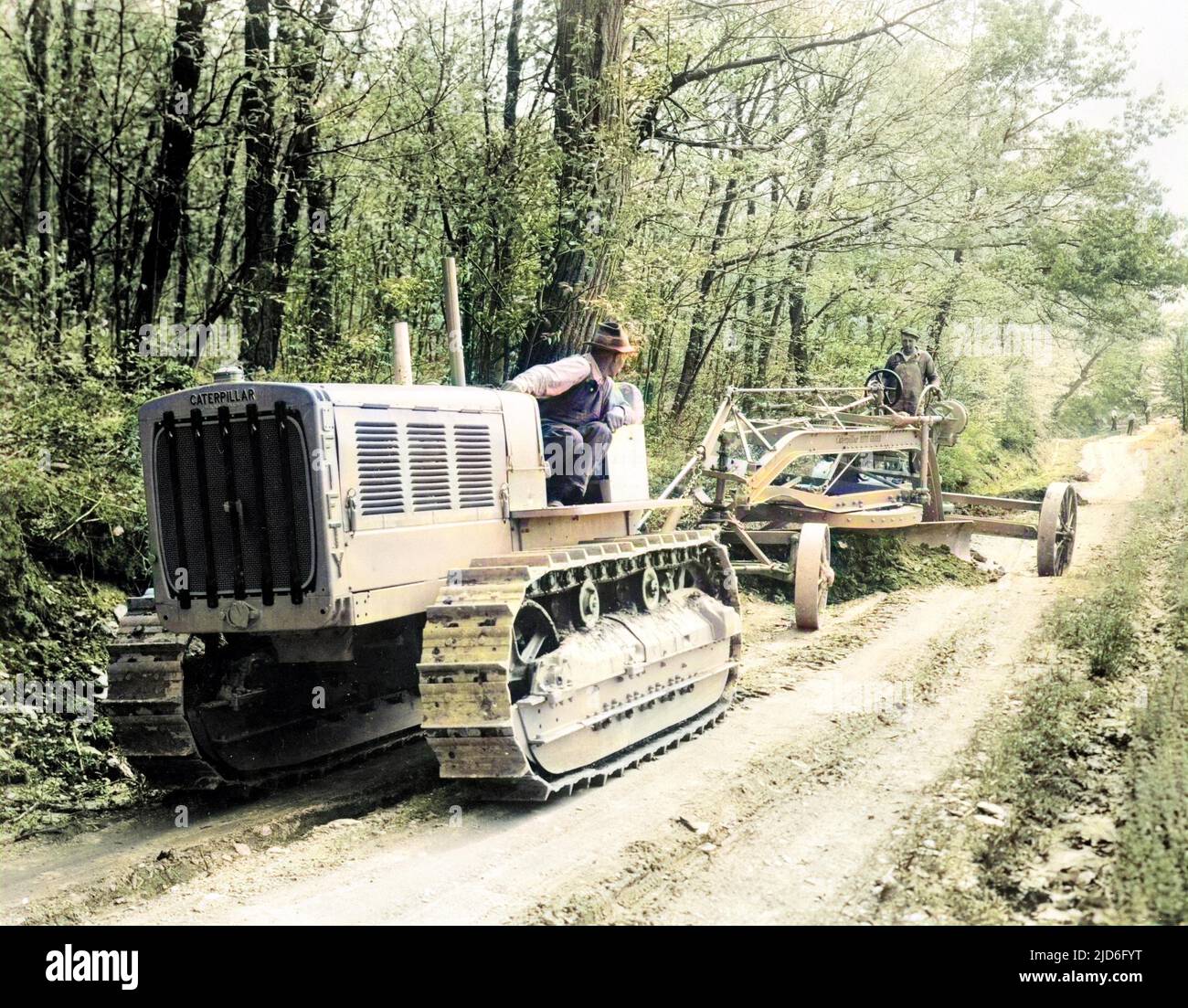 Road making by tractor in rural America. Colourised version of ...