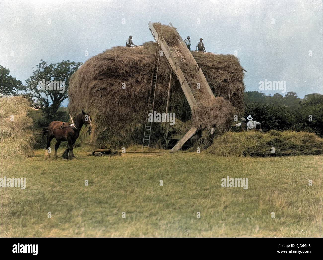 Making a haystack on an English farm. Colourised version of : 10168144 ...