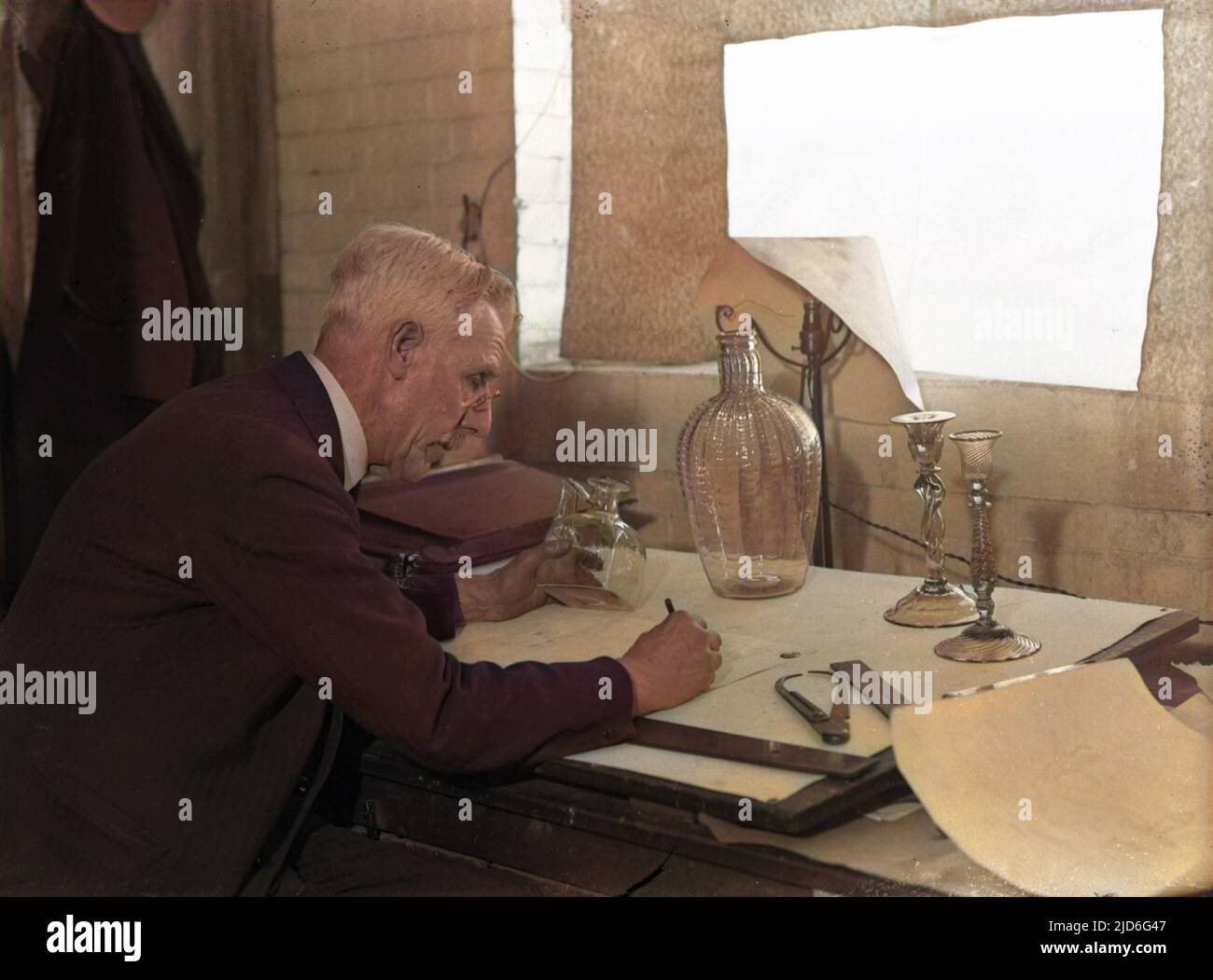 A glass designer at work. Colourised version of : 10169110 Date: Feb-33 ...