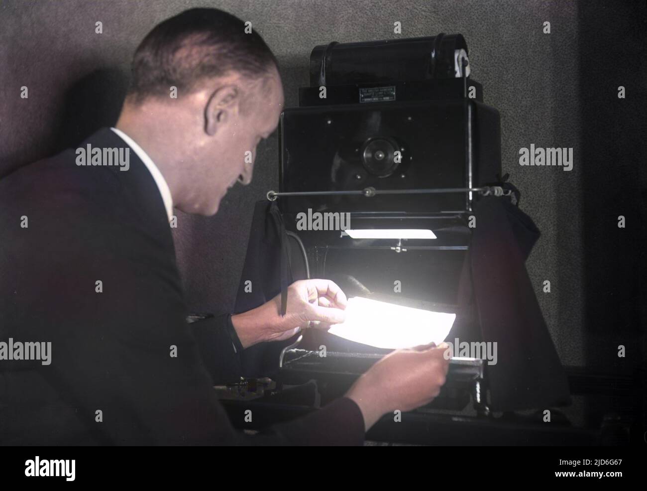 A man demonstrates a 'modern' ultra violet radiation treatment machine ... A man demonstrates a 'modern' ultra violet radiation treatment machine ...