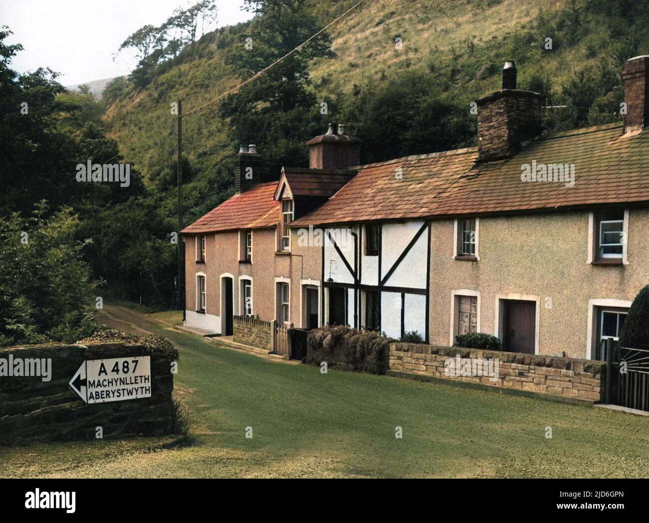 Typical traditional Welsh cottages beside the River Dovey, near ...