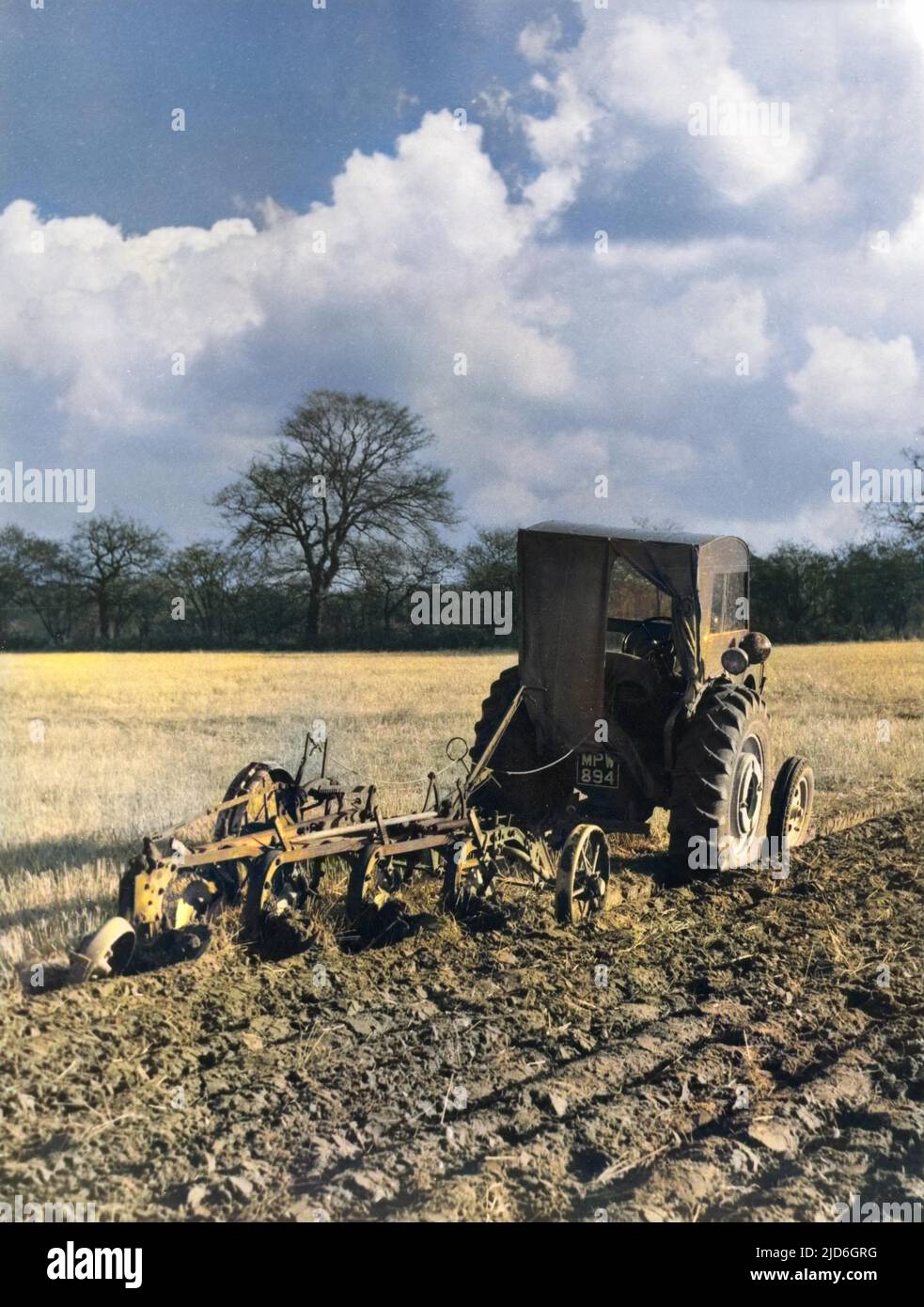 Shallow four-furrow ploughing on a farm in Norfolk, England ...