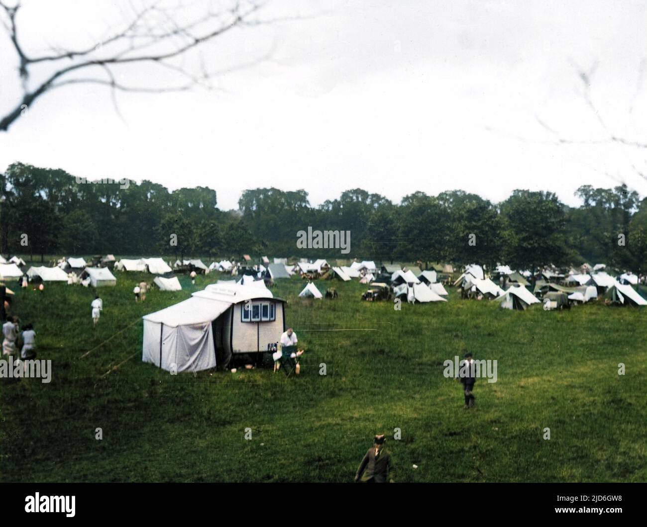 A popular British camp site, full of tents. Note the luxury caravan and ...