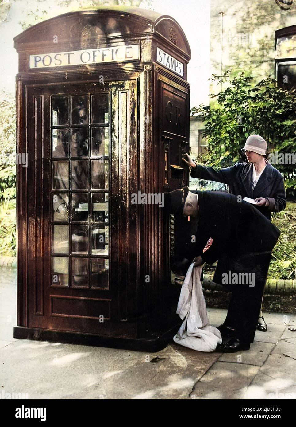 A new telephone kiosk in use in a London street, showing a caller ...