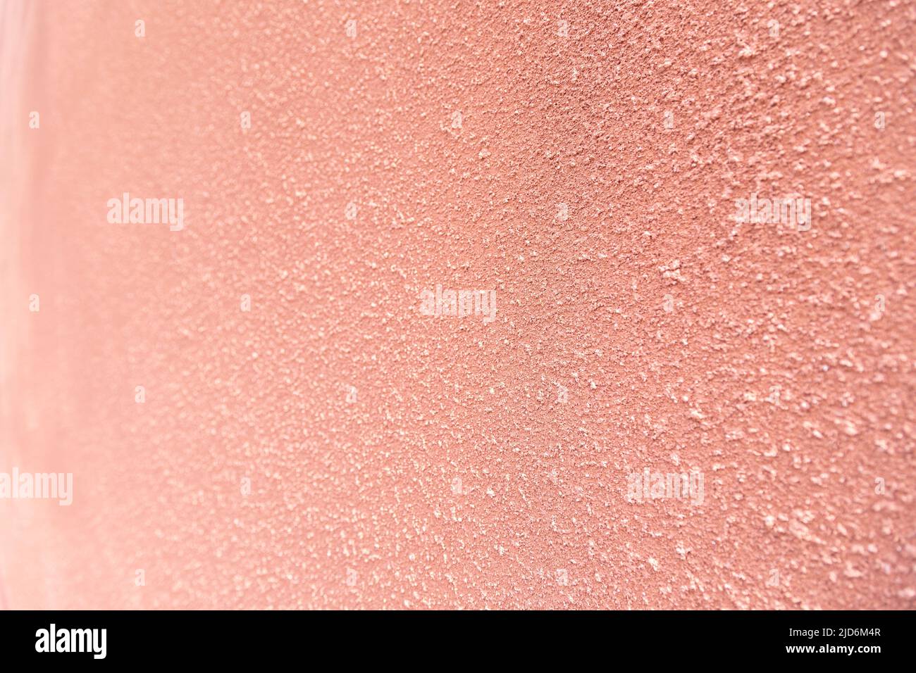 Close-up of a plastered and rough concrete or stone wall painted in ...