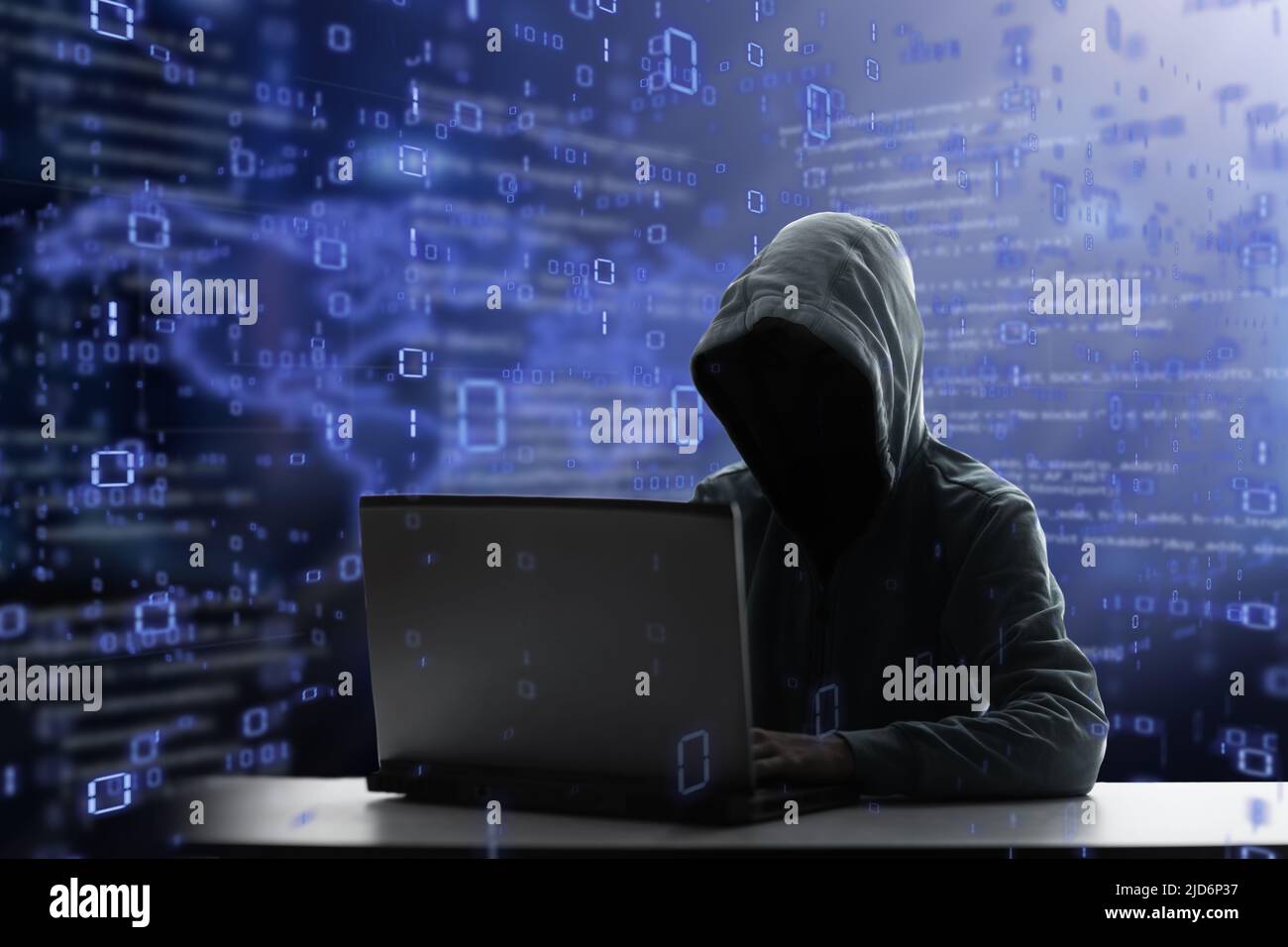 Hacker at laptop. Malware and virus danger. Man in hoodie and dark mask ...